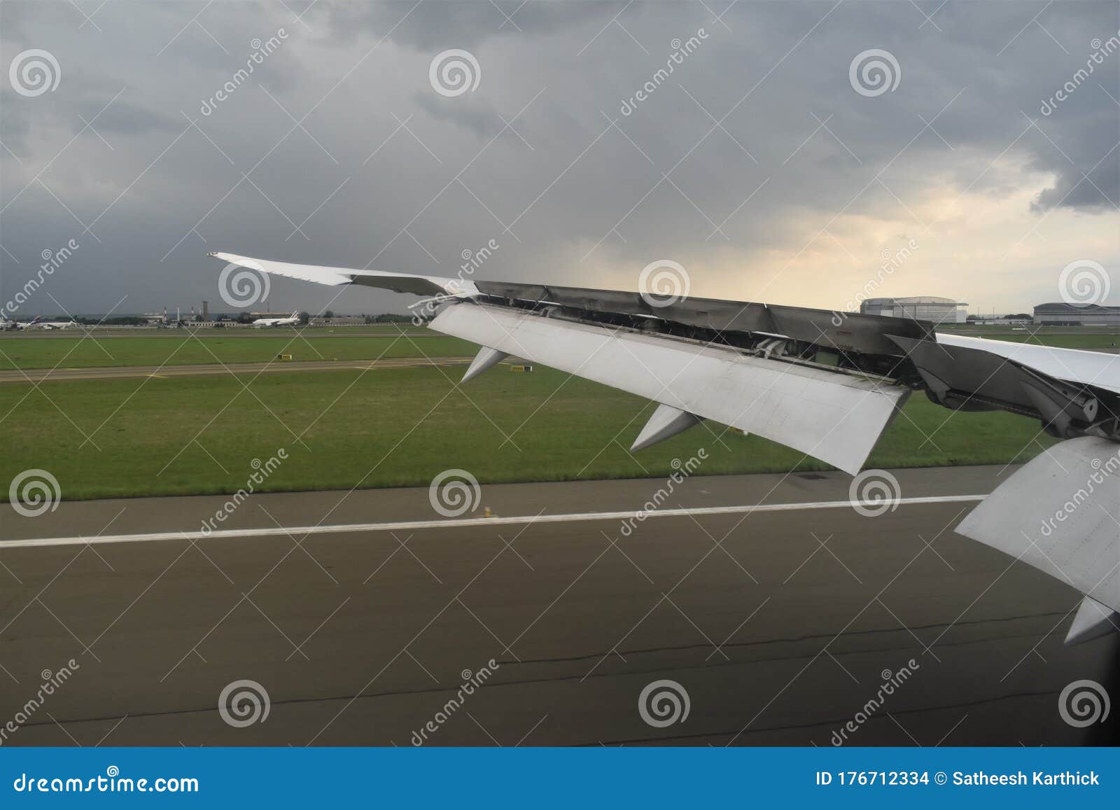Wing of a Airplane with Reverse Thrust Engaged while Landing. Stock ...