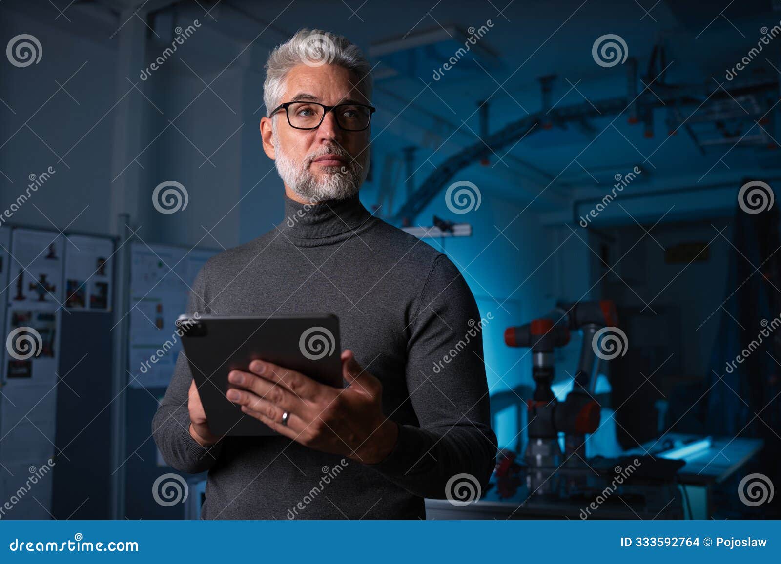 Portrait of Robotics Engineer Holding Tablet, Standing in Laboratory ...
