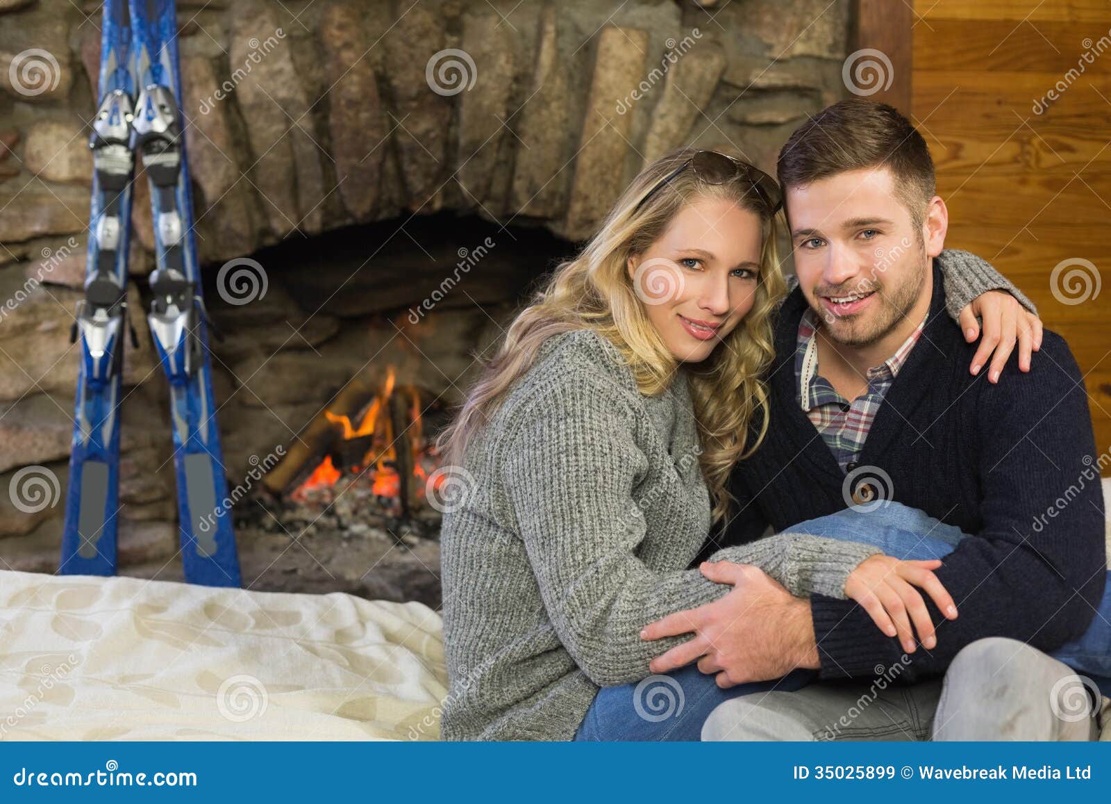 Portrait of a Romantic Couple in Front of Lit Fireplace Stock Image ...