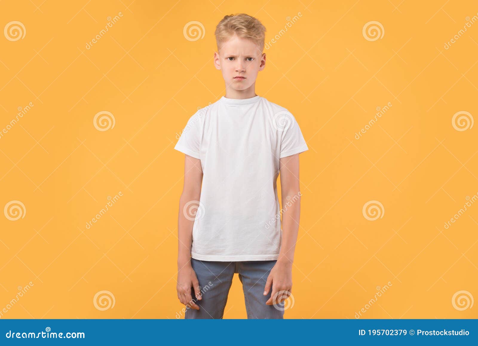 Portrait of Sad Angry Boy Standing at Orange Studio Wall Stock Image ...