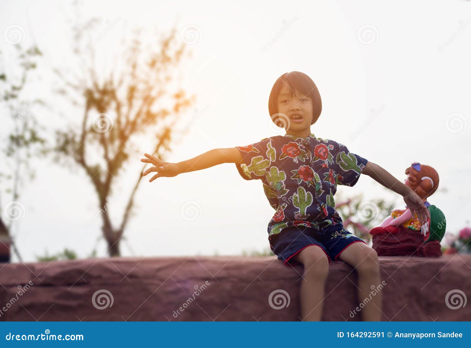 Portrait of Sad Child Sitting Outdoors Stock Image - Image of outdoors ...