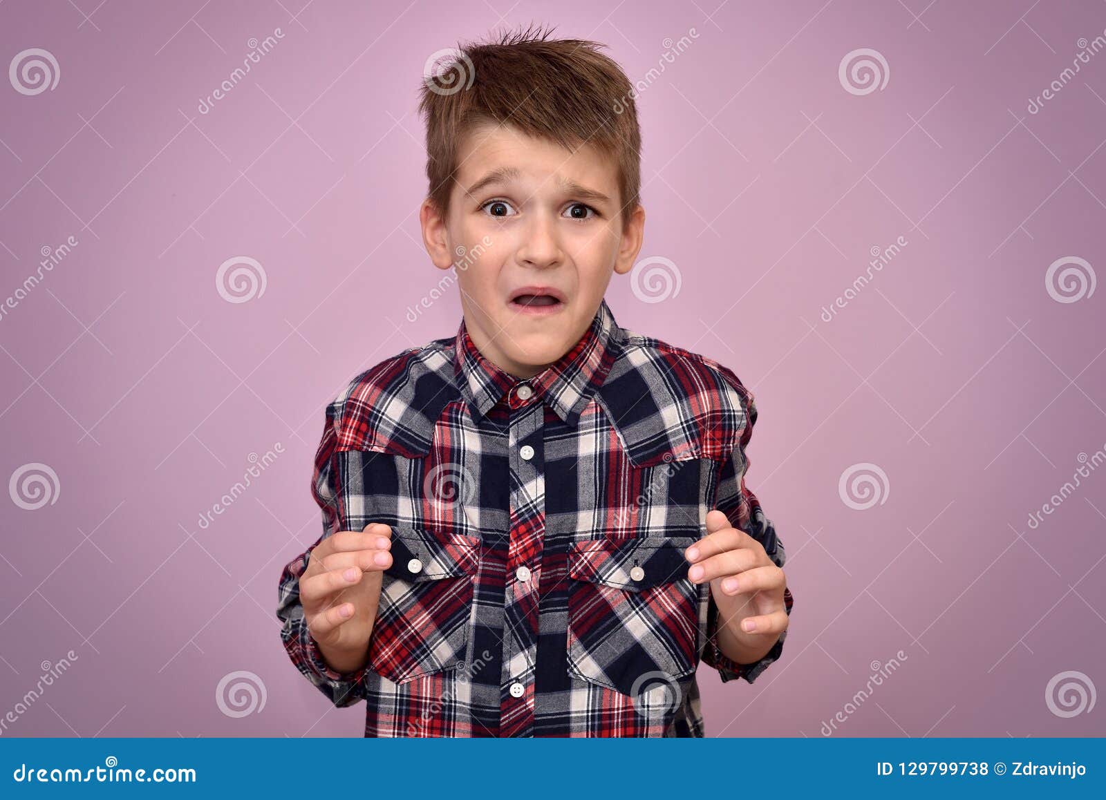 Scared young boy stock photo. Image of disappointed - 129799738