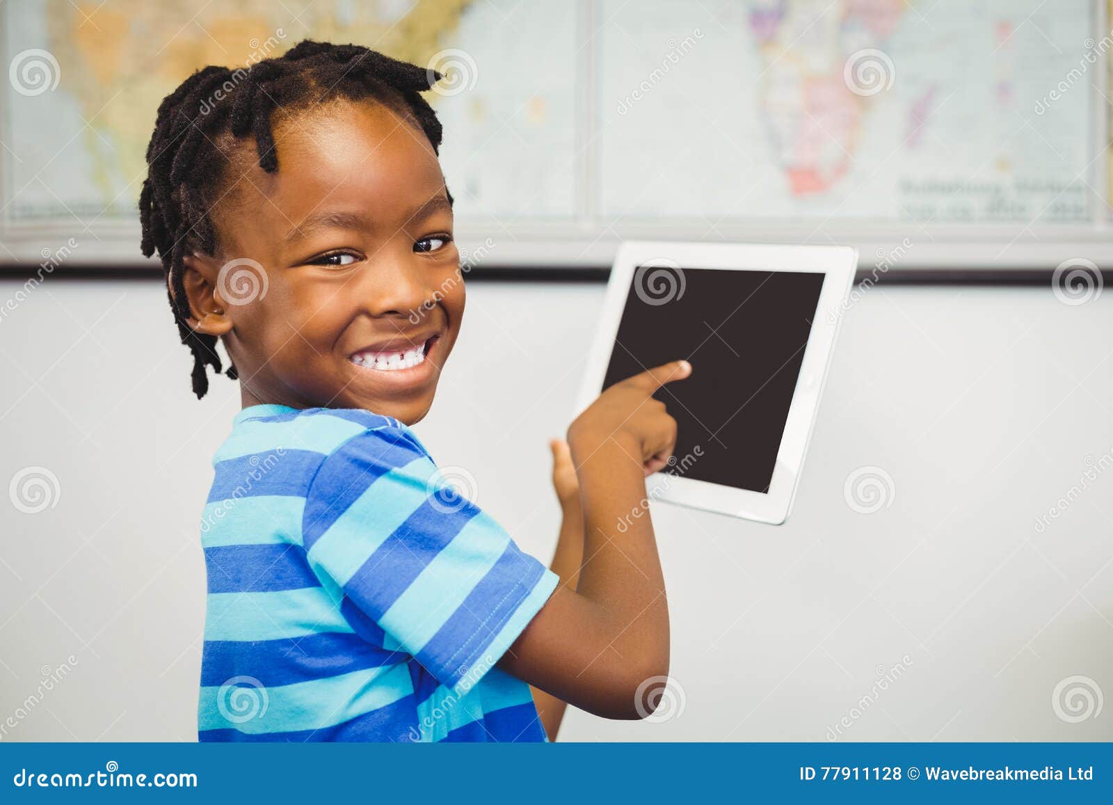 Portrait of School Boy Using a Digital Tablet in Classroom Stock Photo ...