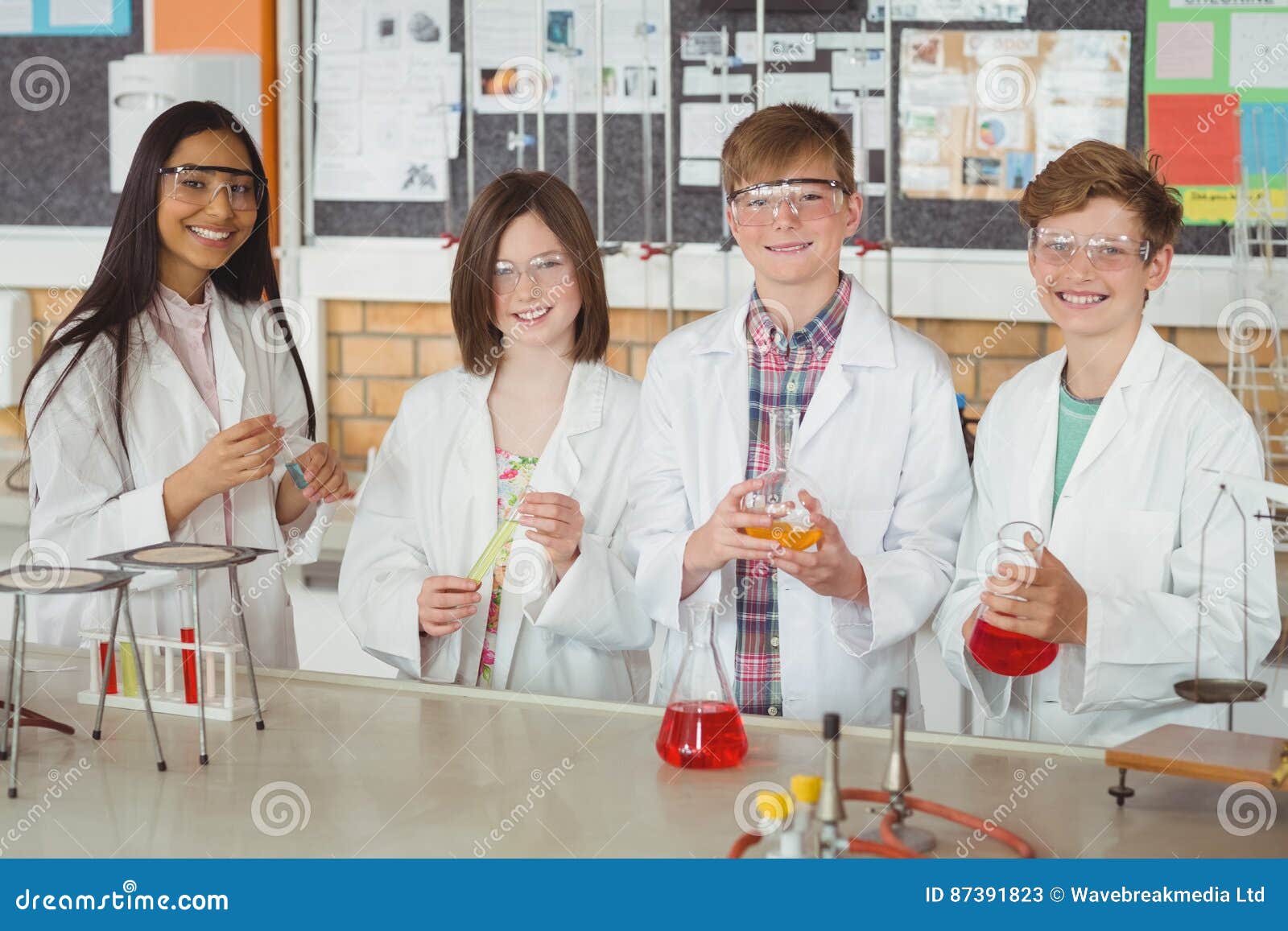 Portrait of School Kids Doing a Chemical Experiment in Laboratory Stock ...