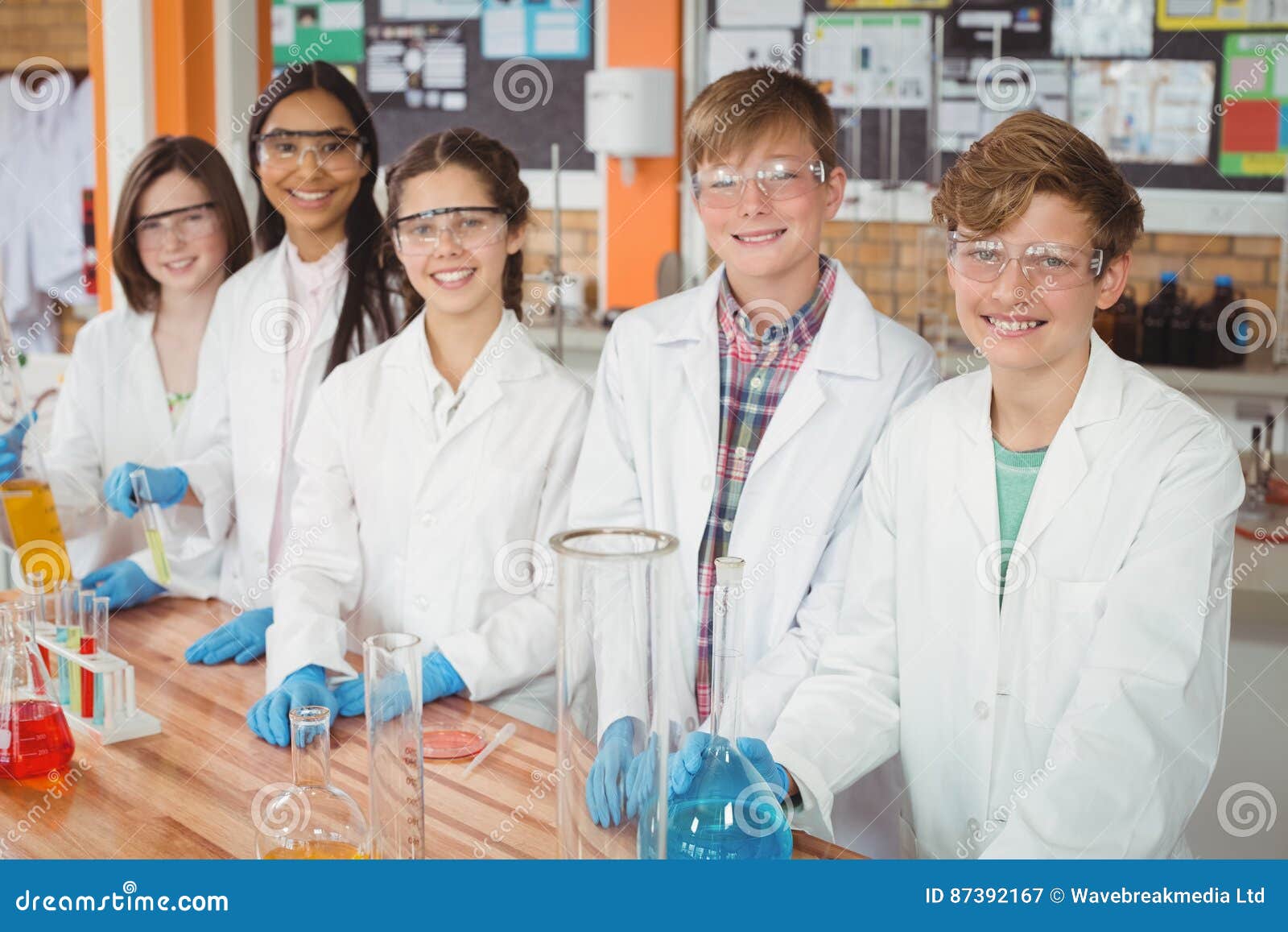 Portrait of School Kids Doing a Chemical Experiment in Laboratory Stock ...