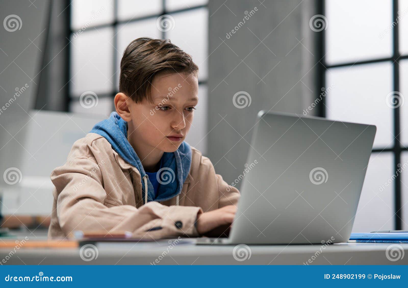 Portrait of Schoolboy Using Computer in Classroom at School Stock Image ...