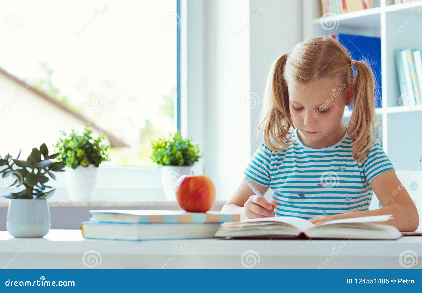 Portrait of Schoolgirl at Classroom Writing at the Table Stock Image ...