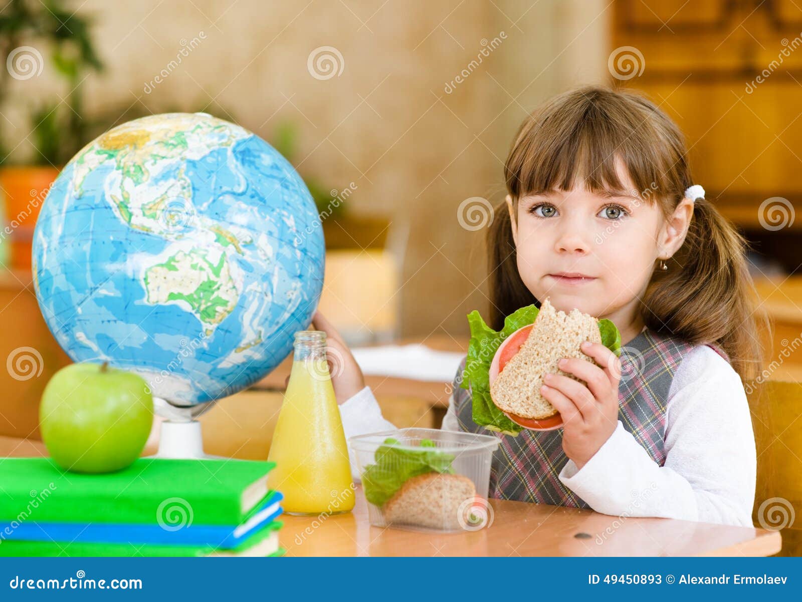 Portrait Schoolgirl Looking at Camera while Having Lunch during Stock ...