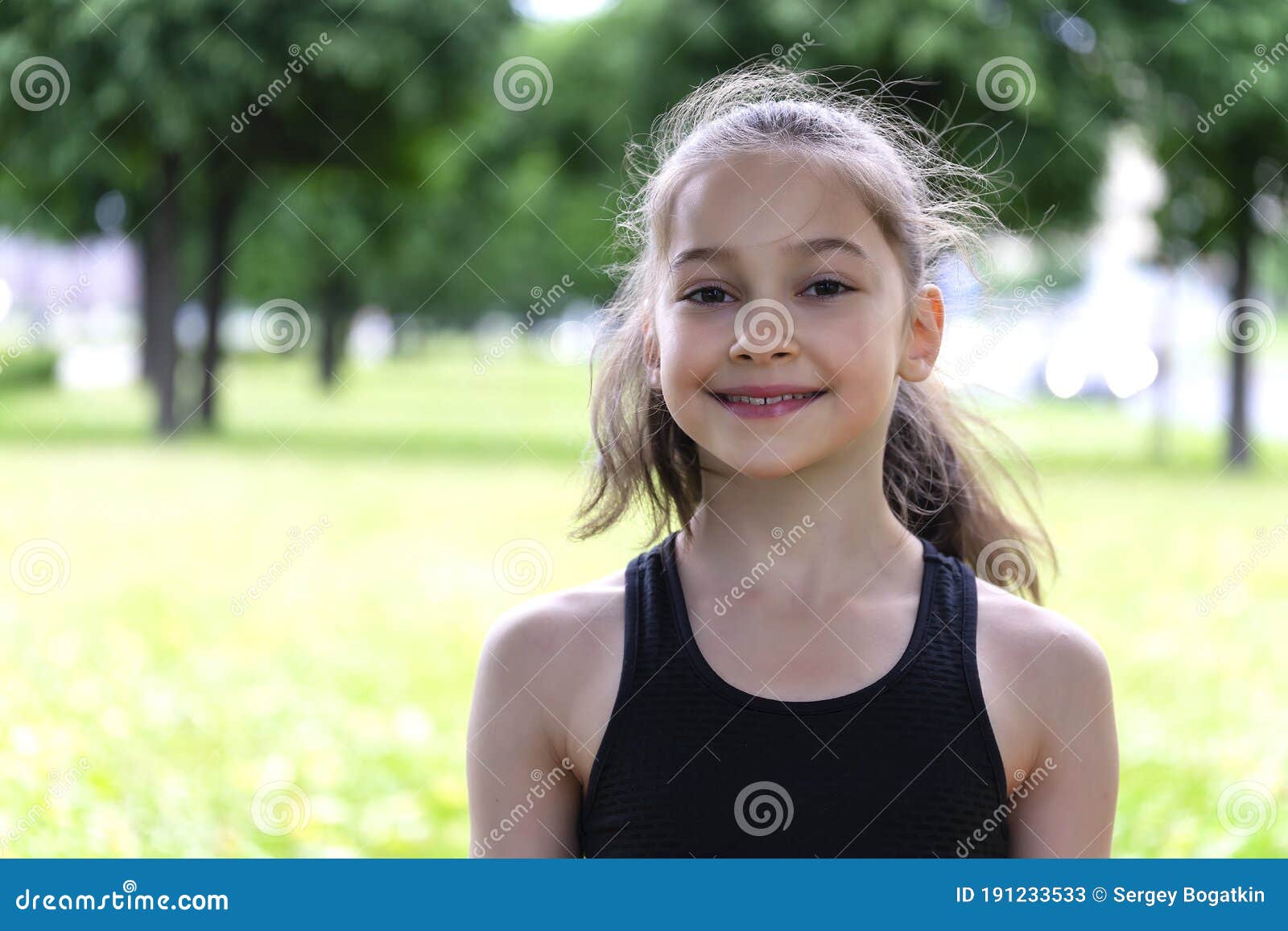 Portrait of a Schoolgirl in a Park with Grass and Trees Stock Image ...