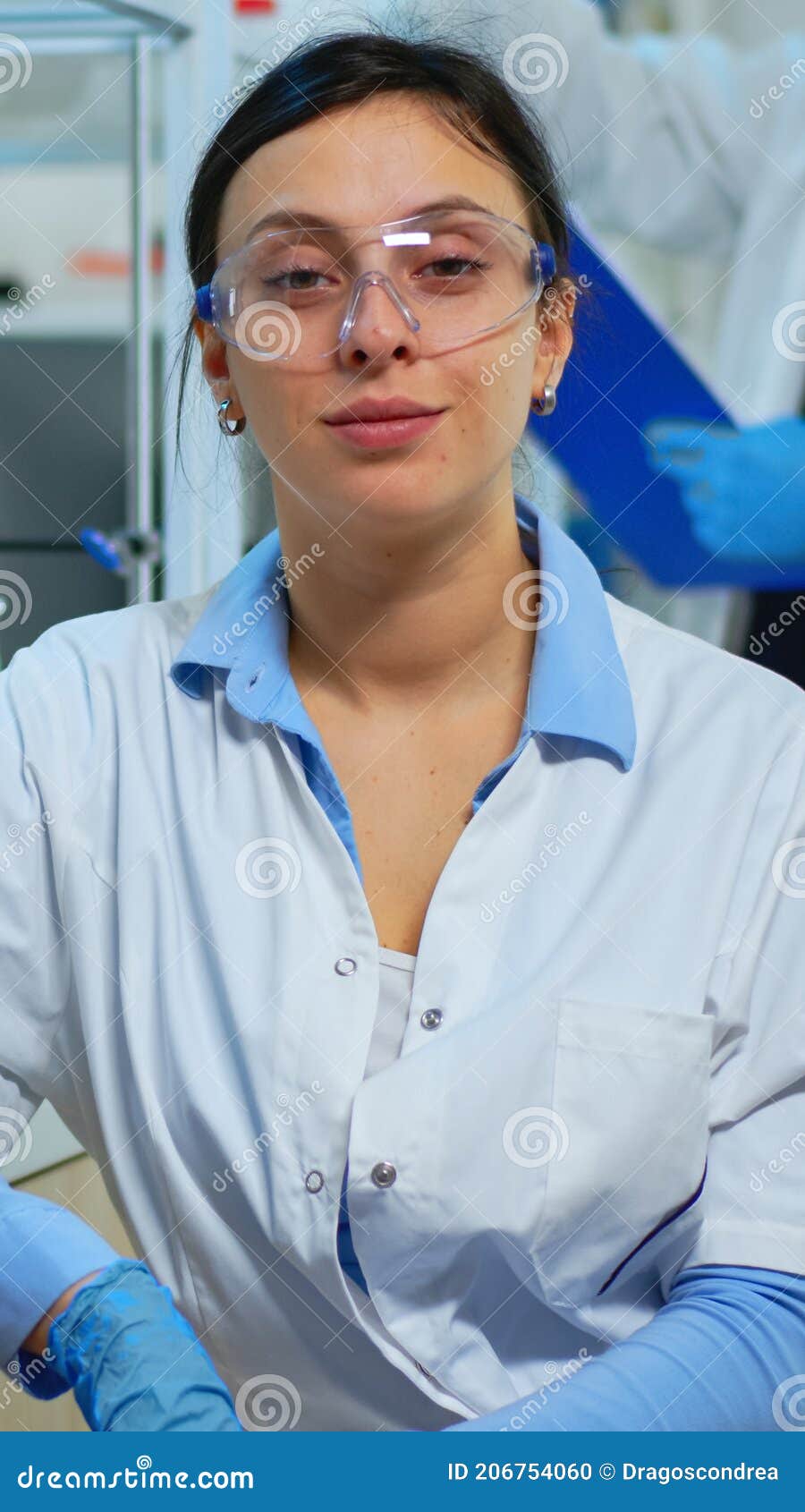 Portrait of Scientist Smiling at Camera Sitting in Modern Laboratory ...