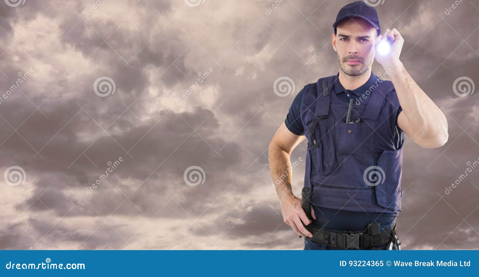Portrait of Security Guard Holding Flashlight Against Cloudy Sky Stock ...