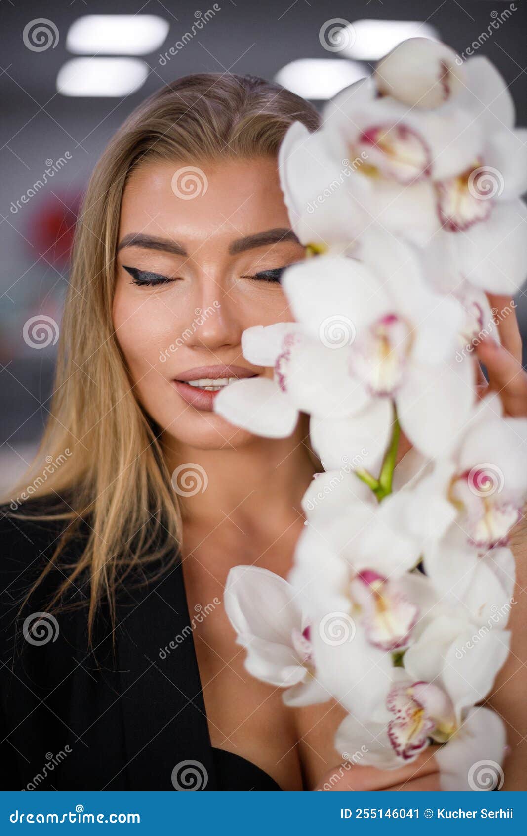 Portrait Of Seductive Blonde Woman With Orchid Branch In Her Hands Stock Image Image Of