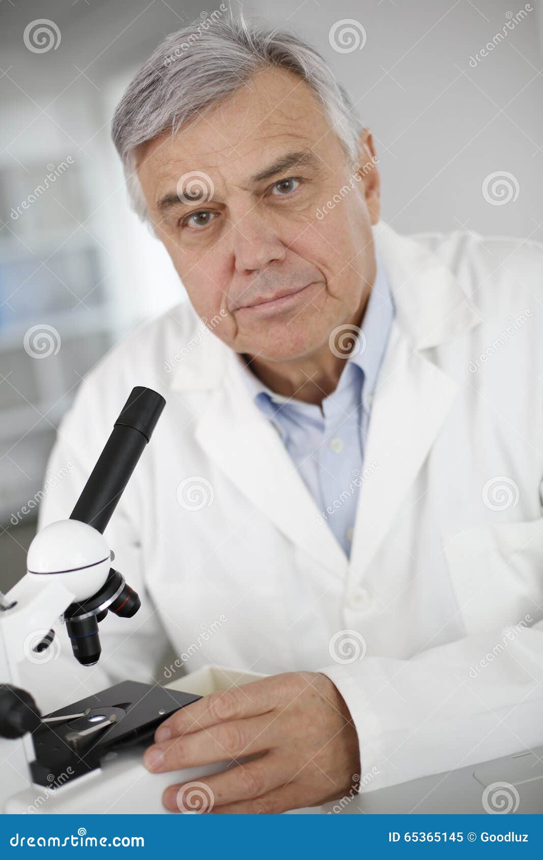 Portrait of Senior Doctor Looking through Microscope Stock Image ...