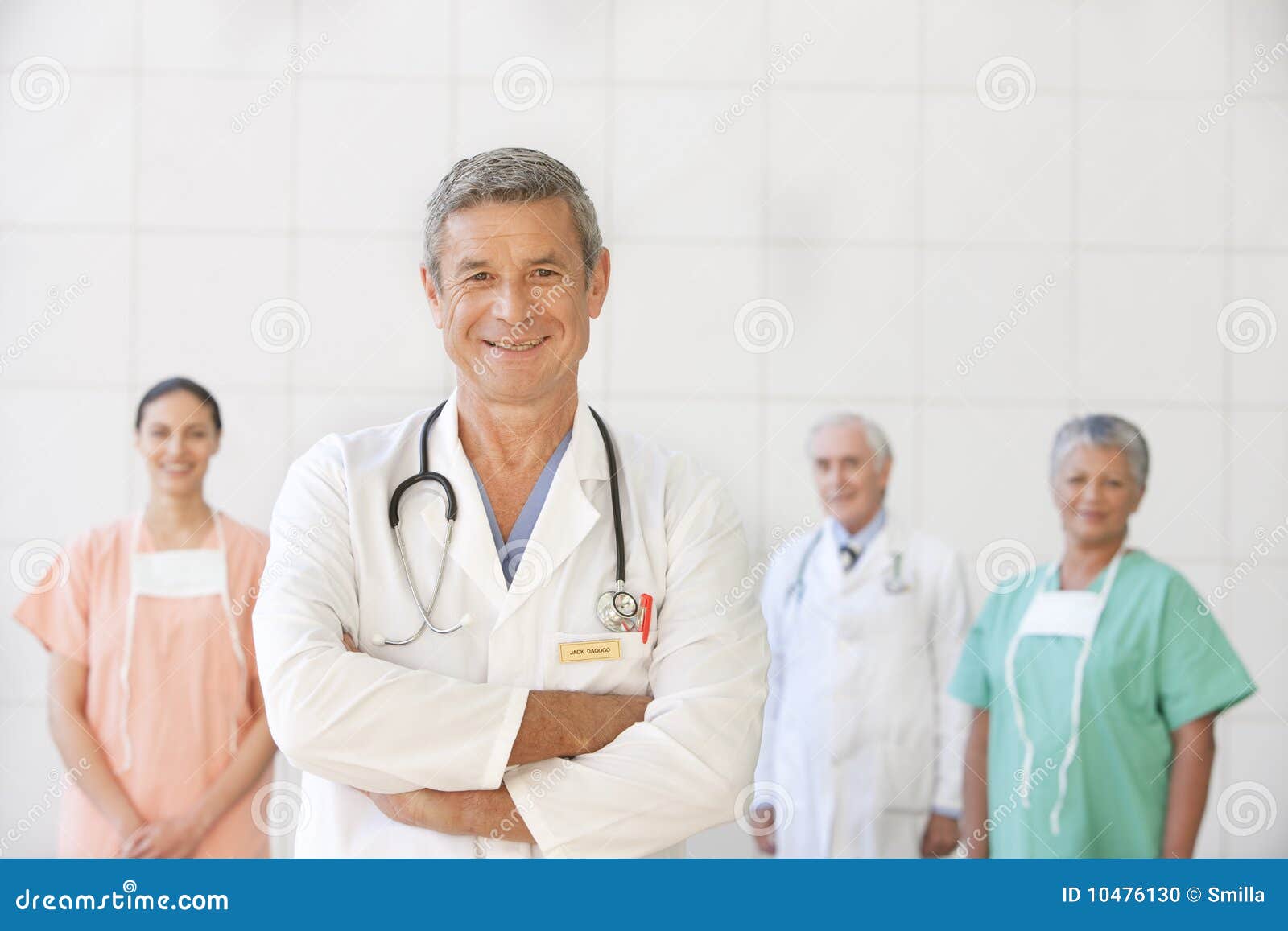 Portrait of Senior Doctor with Staff Stock Photo - Image of background ...