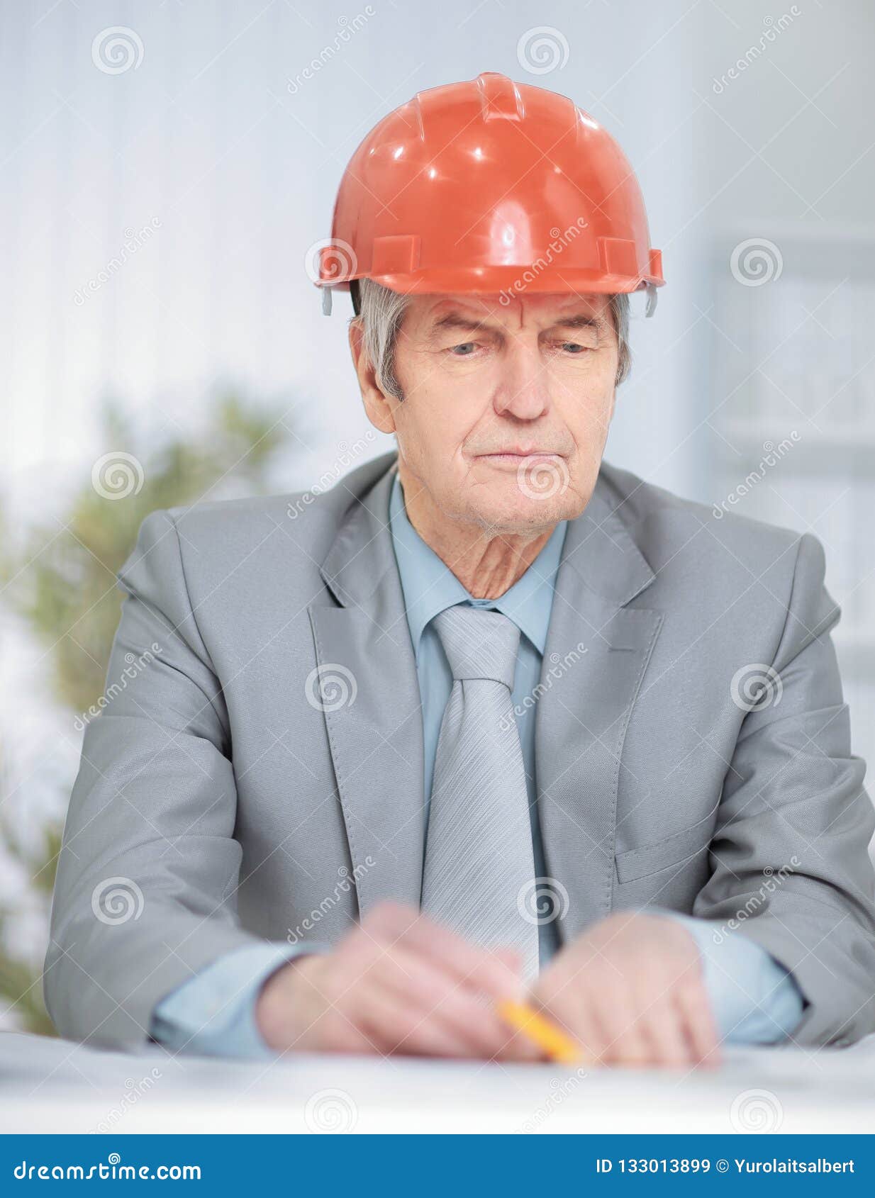 Portrait of a Senior Engineer Sitting at His Desk Stock Image - Image ...