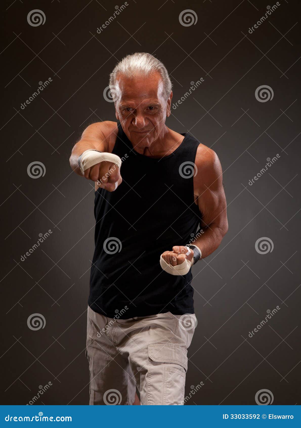 Portrait of a Senior Fighter Punching Towards Camera Stock Photo ...
