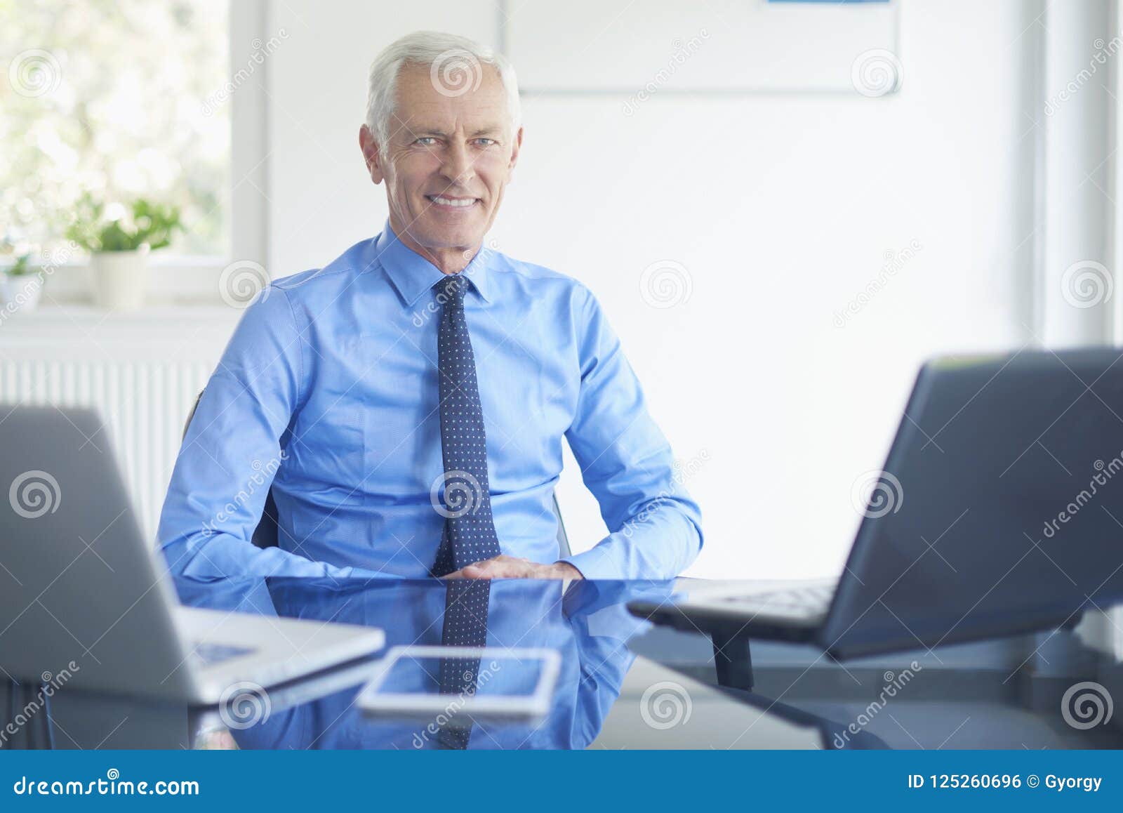 Successful Businessman Sitting at Office Desk Stock Photo - Image of ... Successful Businessman Sitting at Office Desk Stock Photo - Image of ...