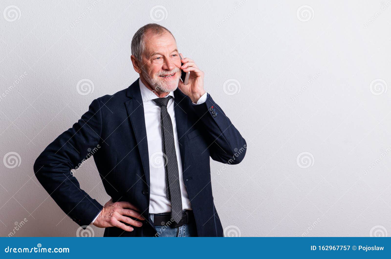 Portrait of a Senior Man with Smartphone in a Studio, Making Phone Call ...