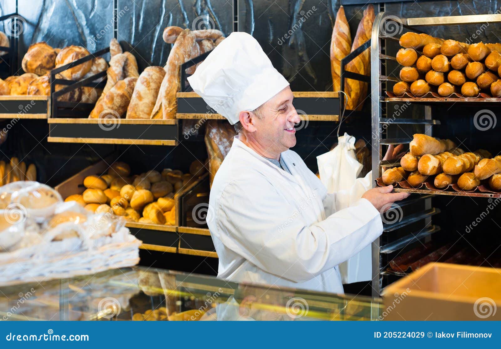 Portrait of Baker with Fresh Bread Smiling in Bakery Stock Image ...