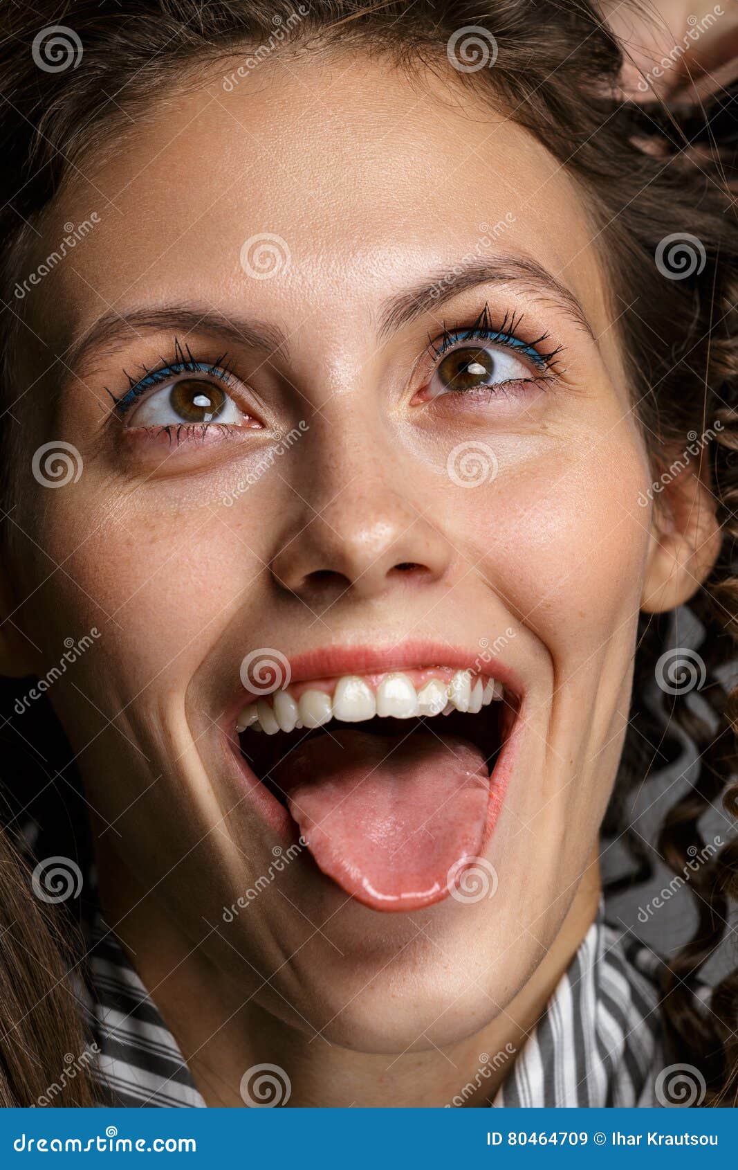 Portrait Of A Sensual Beautiful Young Woman Showing Long Tongue Stock