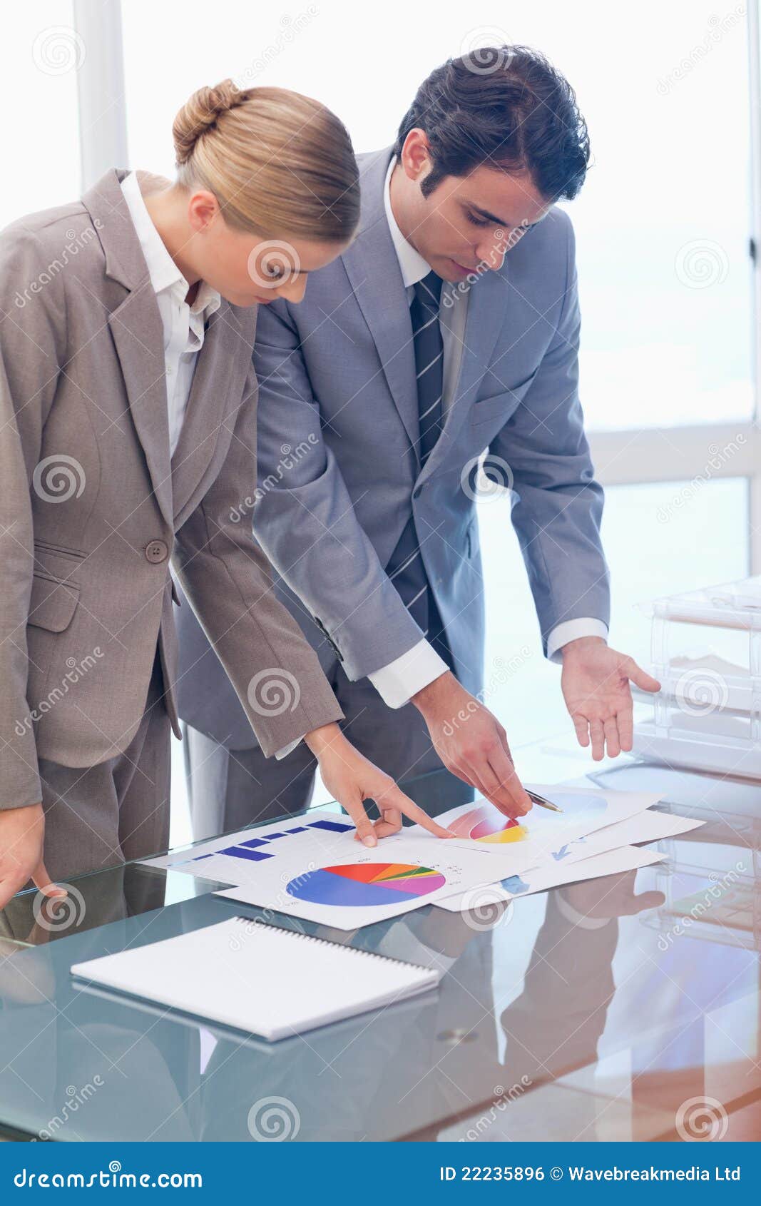 Portrait of Serious Business People Looking at Statistics Stock Photo ...