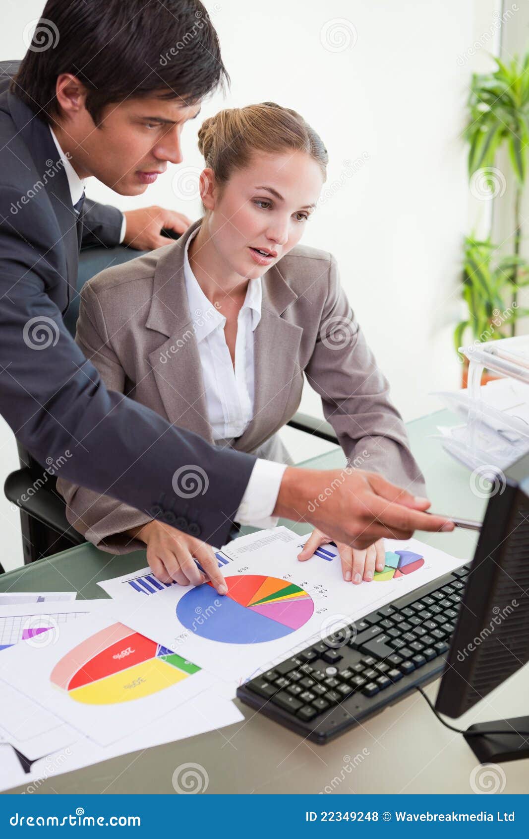 Portrait of a Serious Business Team Studying Statistics Stock Photo ...