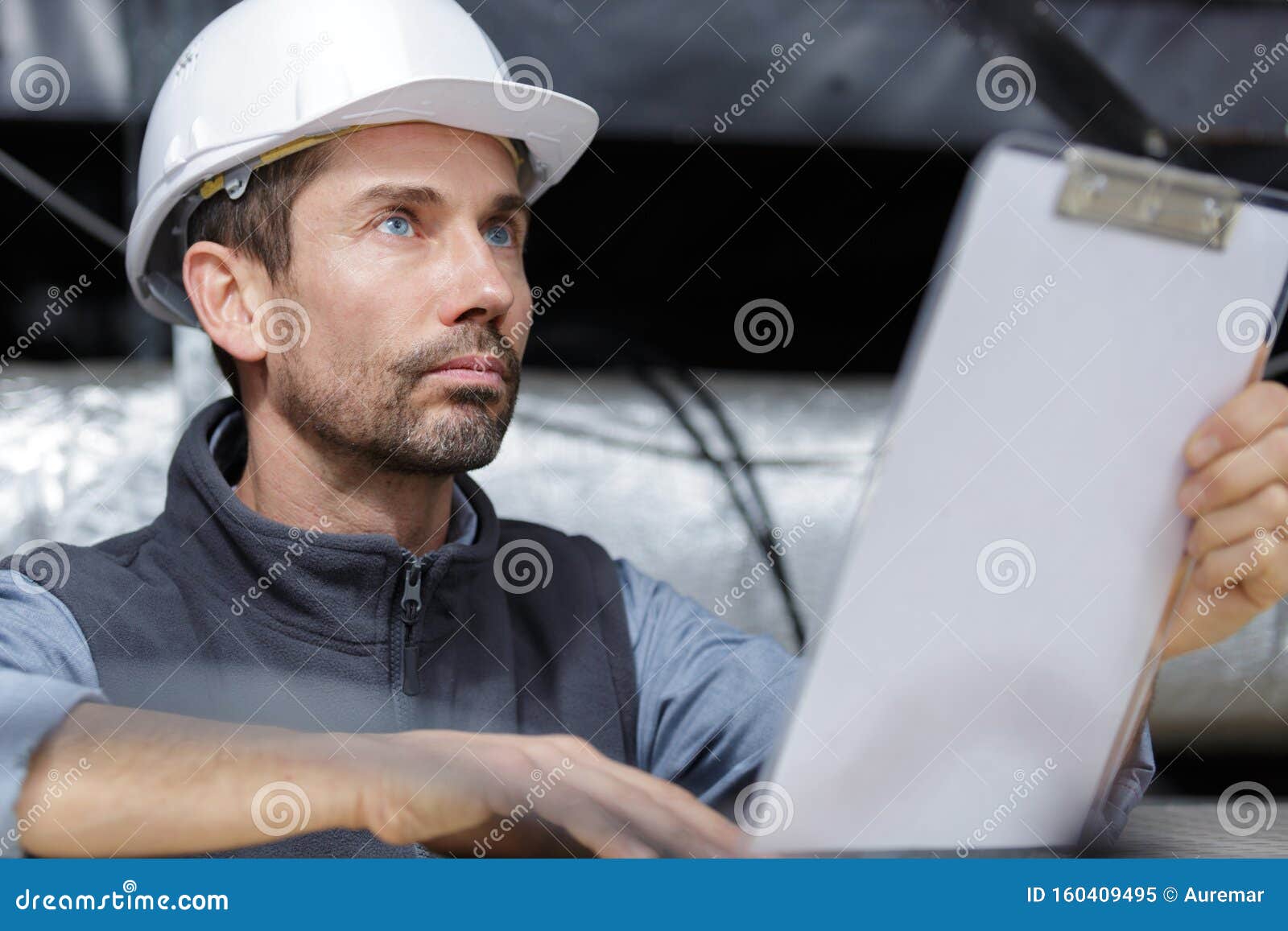 Portrait Serious Engineer Taking Notes on Clipboard Stock Image - Image ...