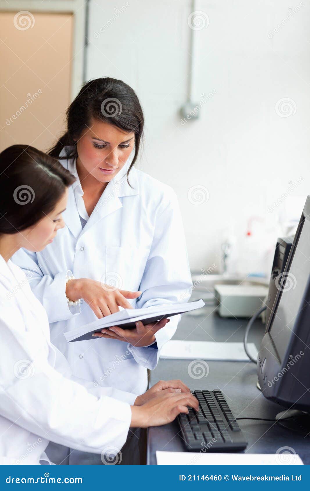 Portrait of Serious Scientists Looking at a Report Stock Photo - Image ...