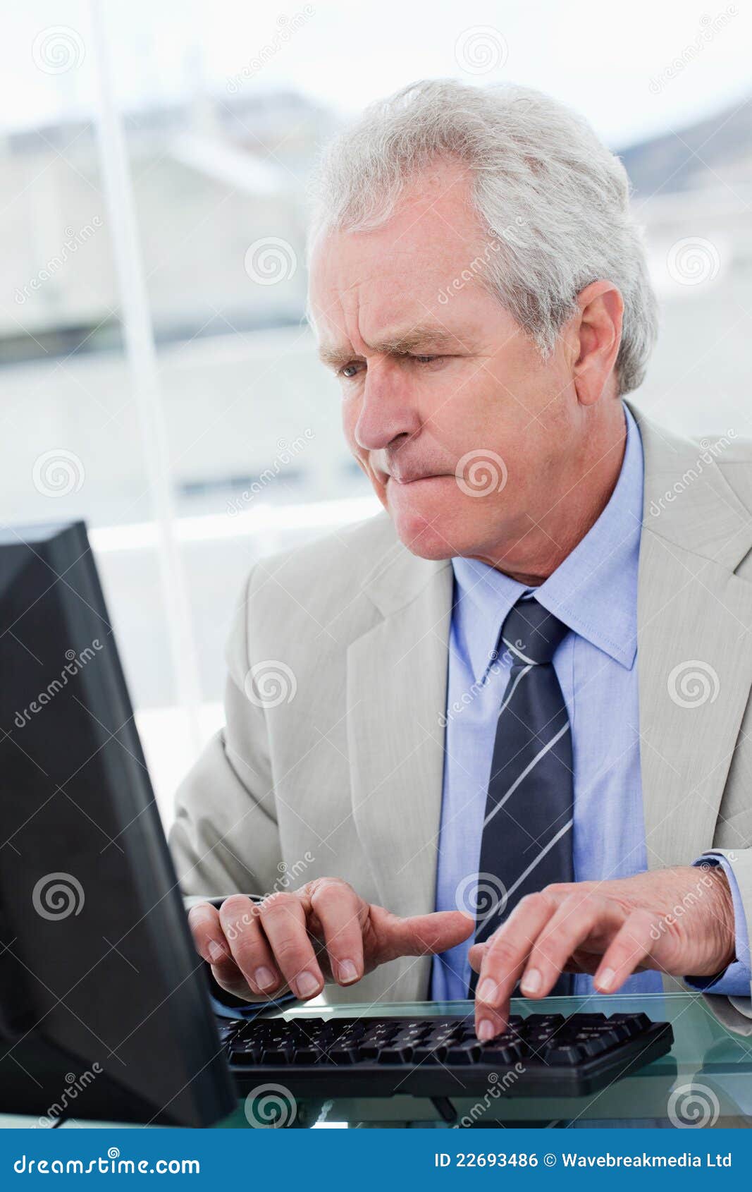 Portrait of a Serious Senior Manager Using a Computer Stock Photo ...