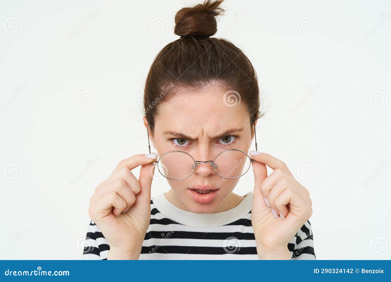 Portrait Of Shocked Angry Woman Frowning Looks Confused At Camera