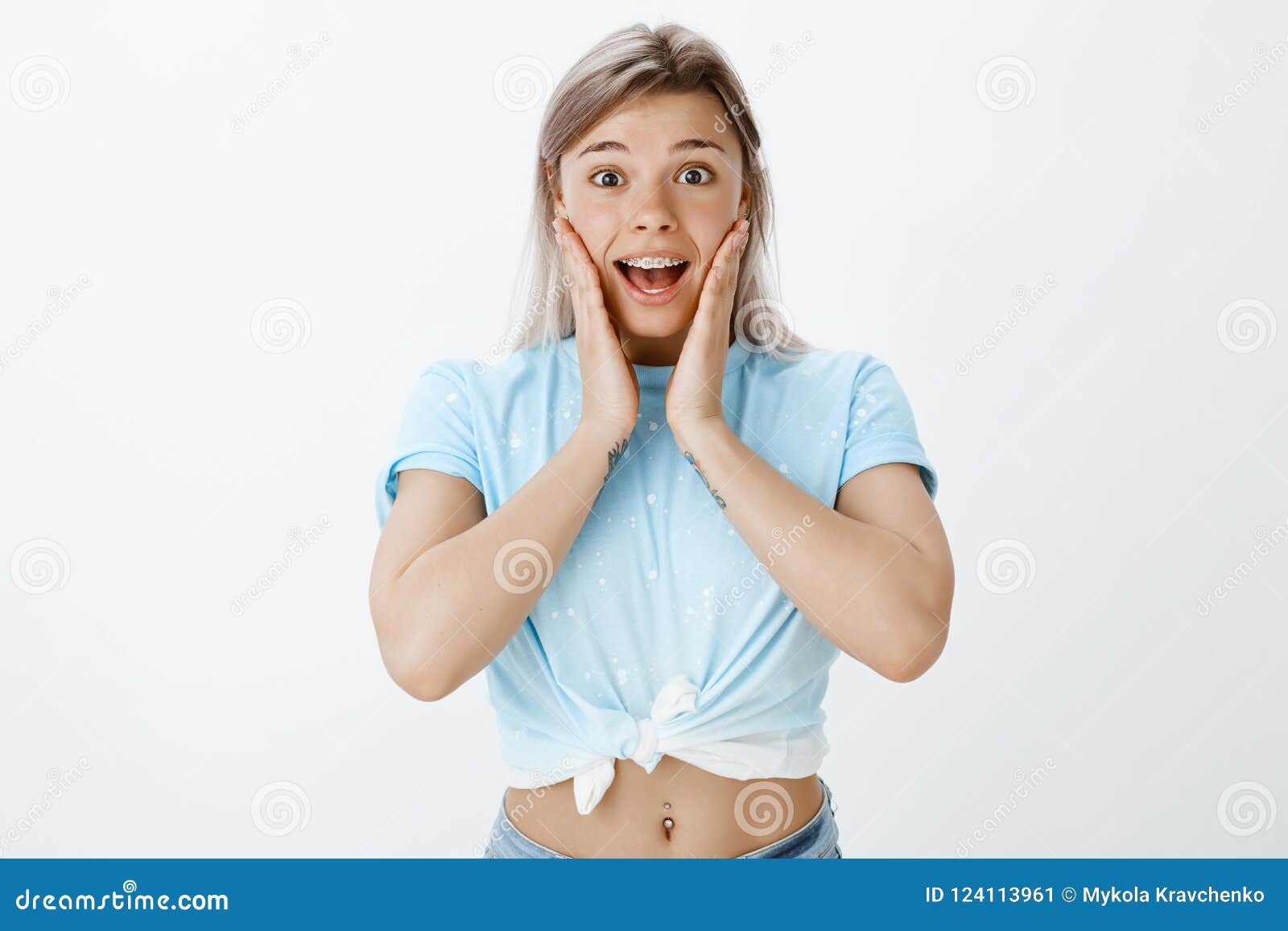 Portrait Of Shocked Attractive Woman Trembling From Surprise And