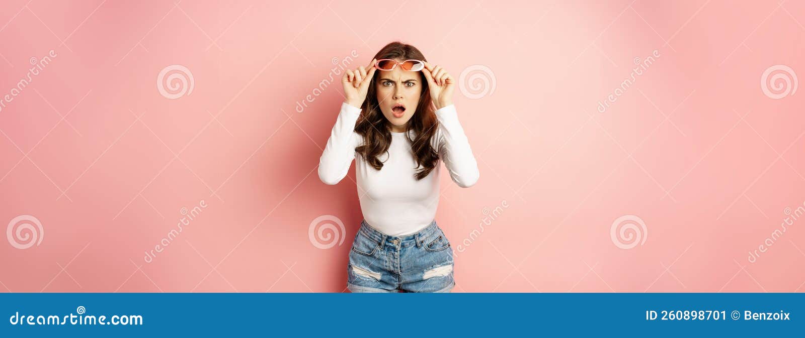 Portrait Of Shocked Woman Takes Off Sunglasses Looking Confused Dont
