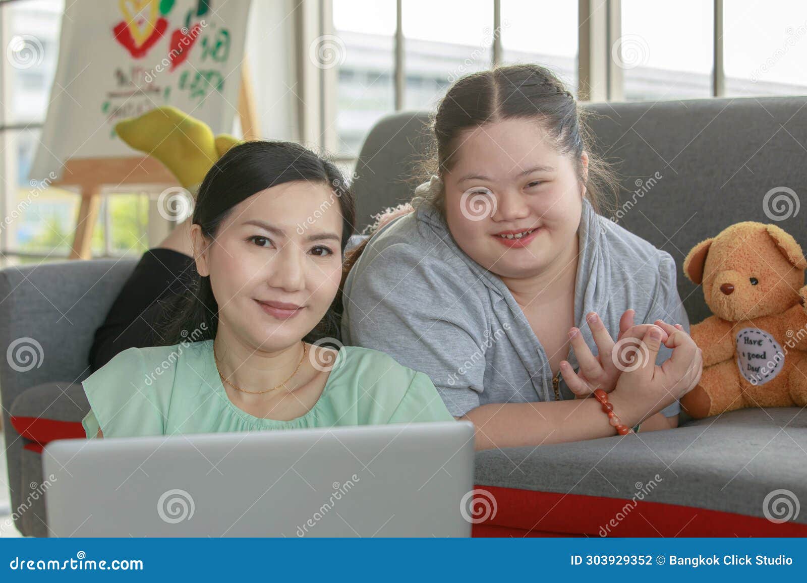 Portrait Shot Of Asian Lovely Mother Sitting On Floor And Young Chubby