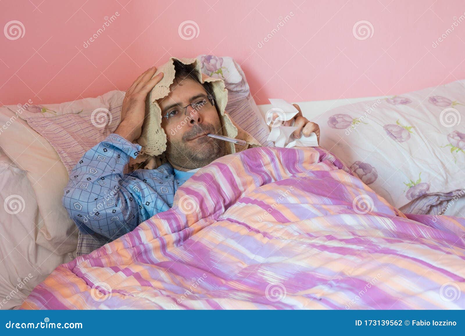 Man with flu into bed stock photo. Image of headache - 173139562