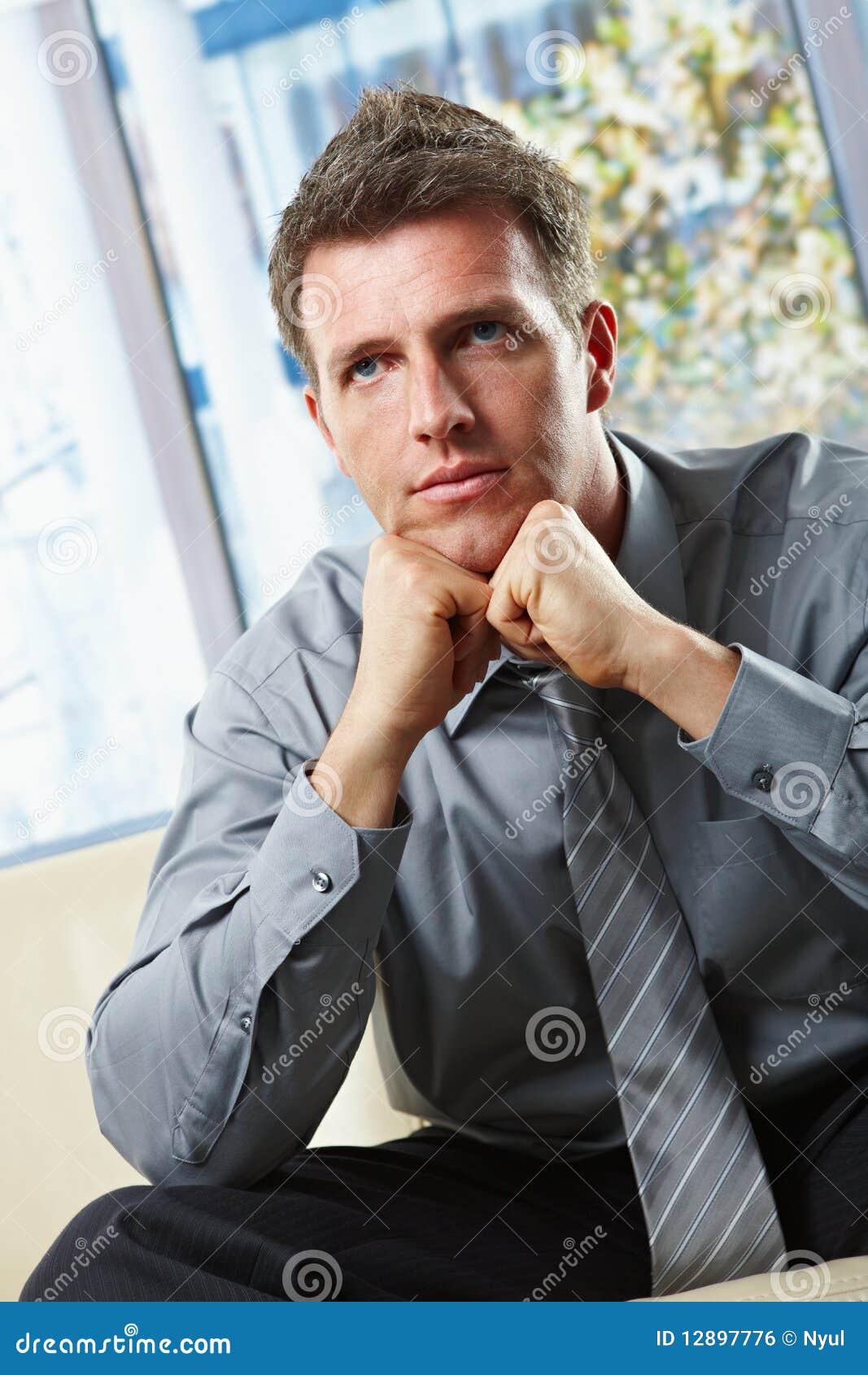Portrait of Sitting Businessman Thinking Stock Photo - Image of ...