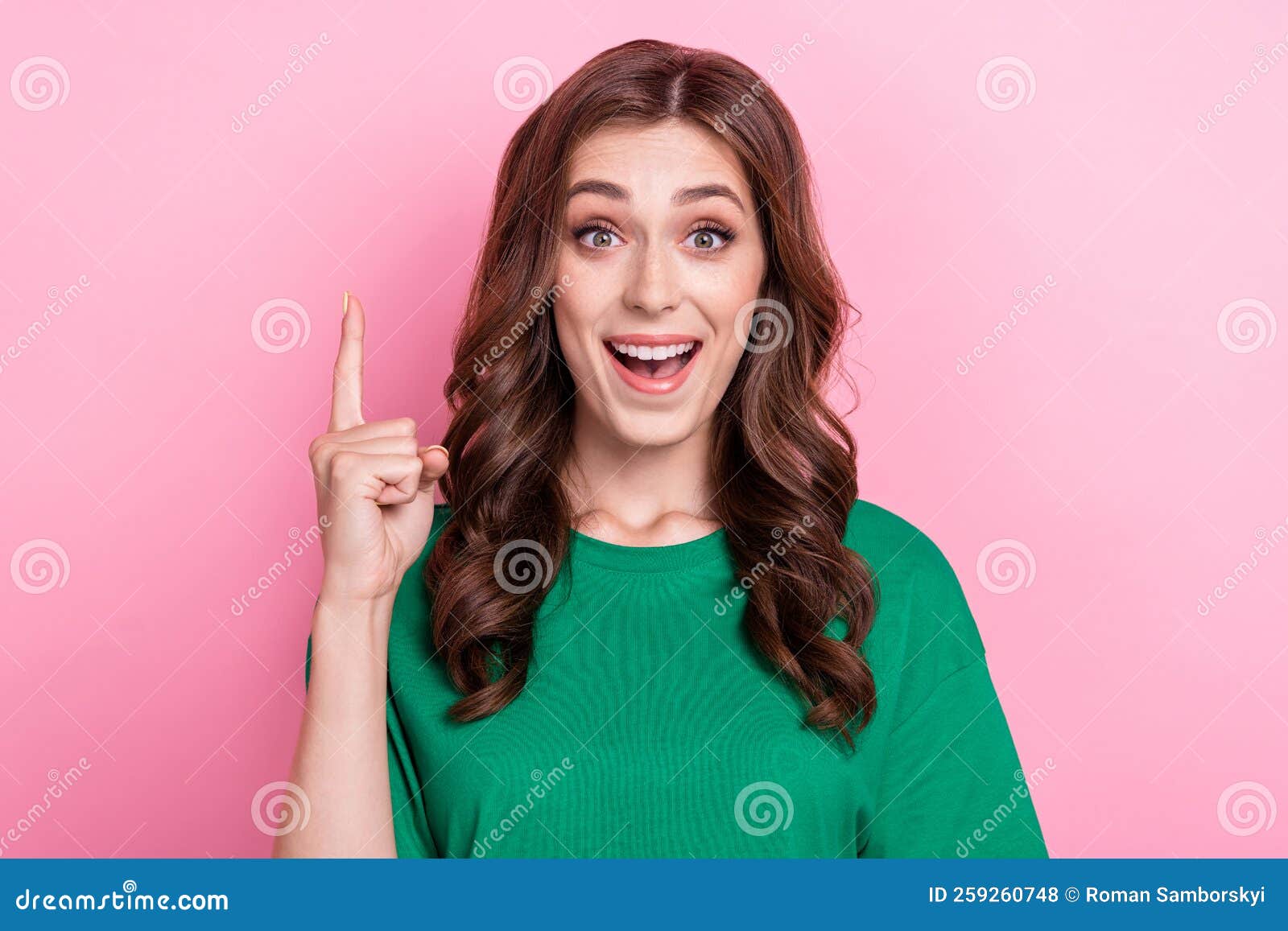 Portrait Of Smart Cute Girlish Woman With Curly Hairstyle Wear Green T
