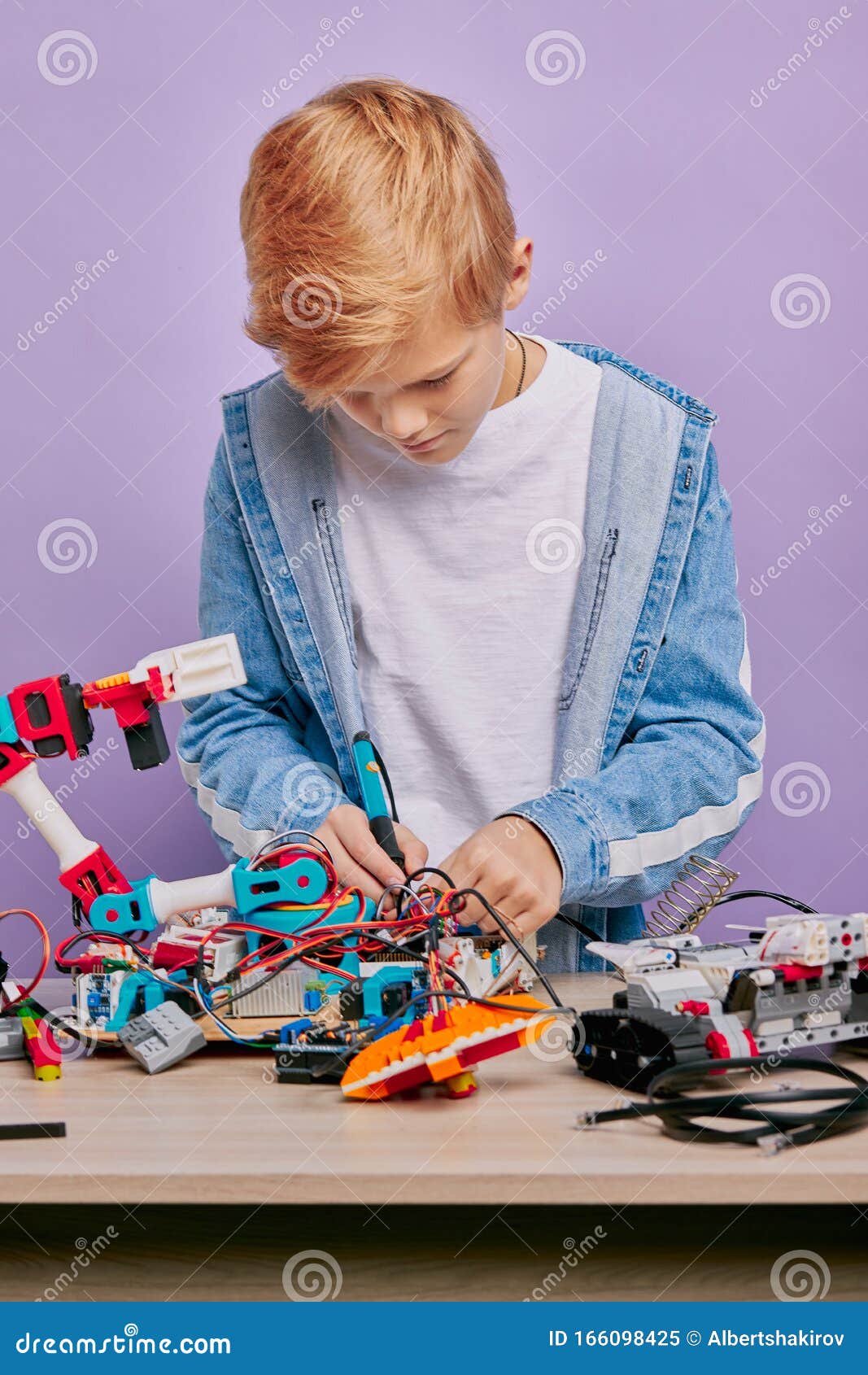 Smart Clever Kid Boy in Casual Wear Assemble Robots Stock Image - Image ...