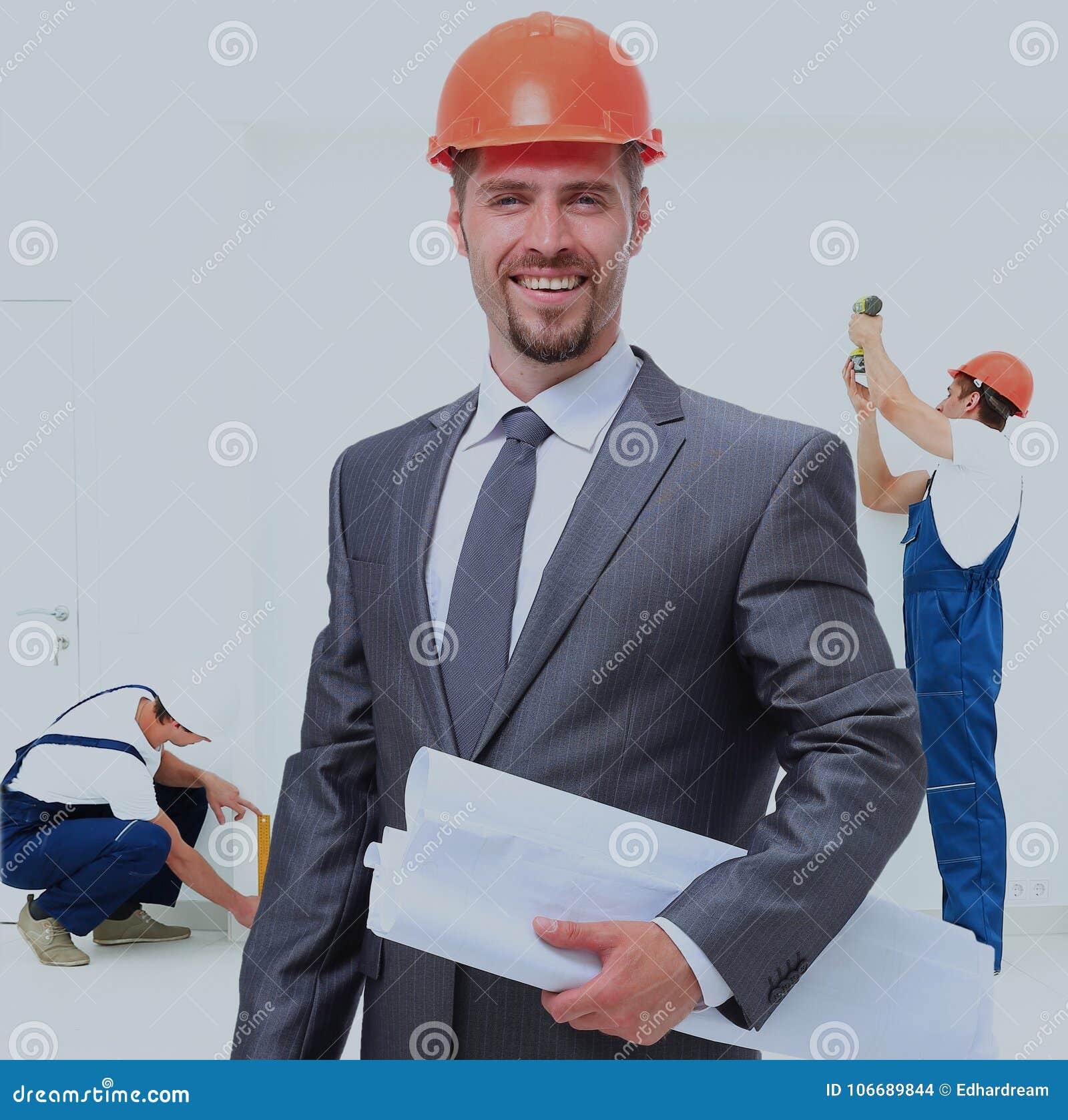 Portrait of a Smiling Architect. Against the Backdrop Team Stock Photo ... Portrait of a Smiling Architect. Against the Backdrop Team Stock Photo ...