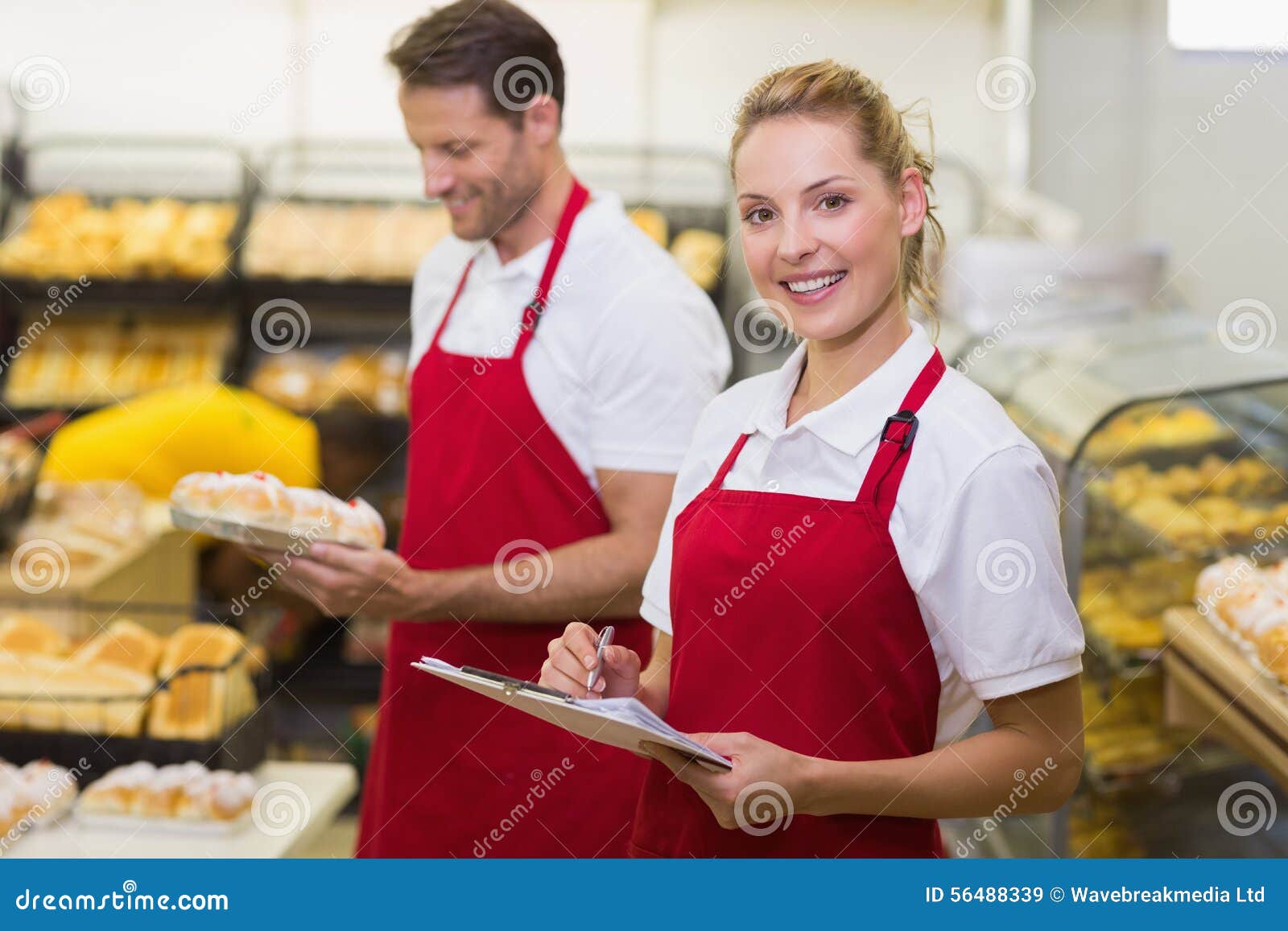 Portrait of a Smiling Baker with Her Colleague Stock Image - Image of ...