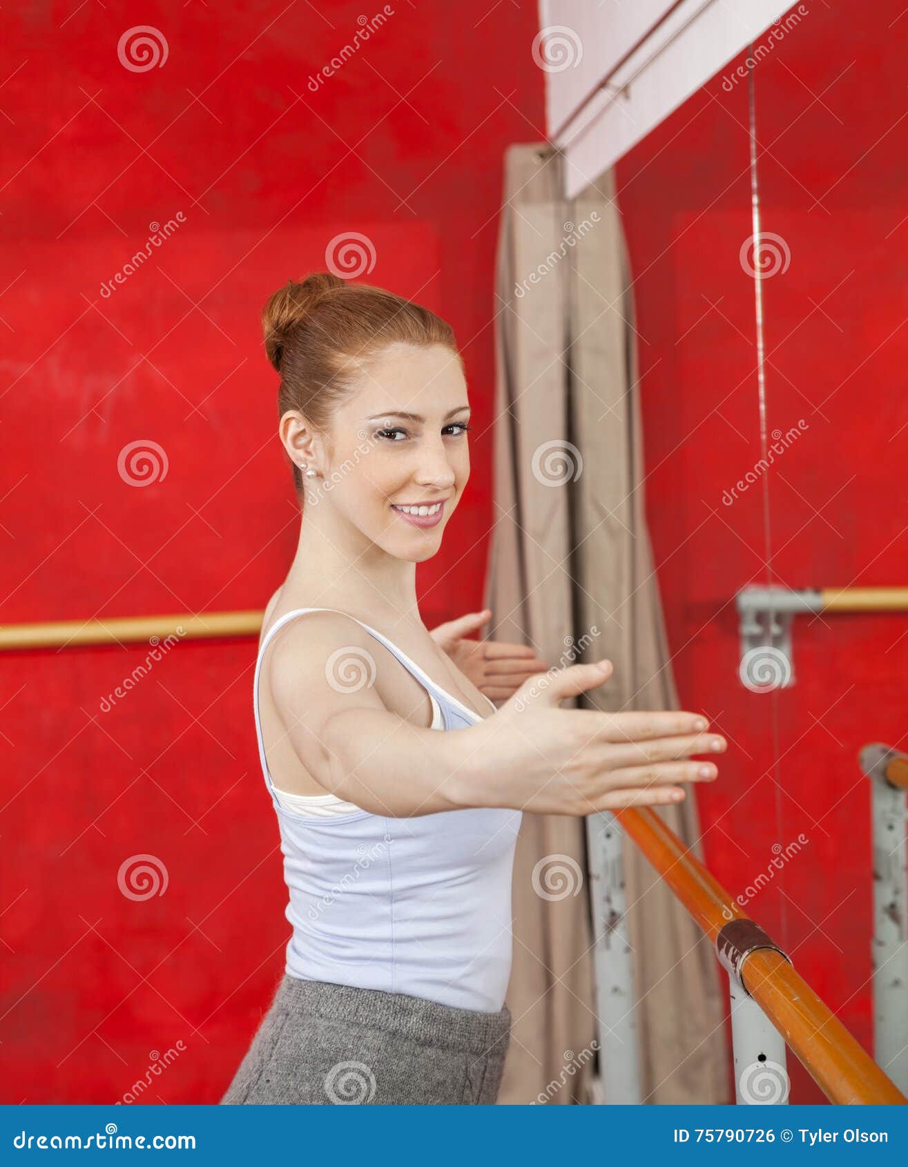 Portrait of Smiling Ballet Dancer Performing in Studio Stock Photo ...