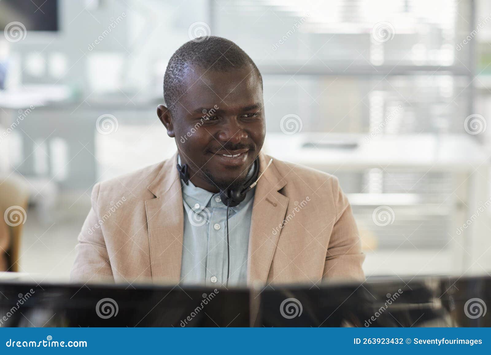 Smiling Black Man Looking at Computer Screen Stock Photo - Image of ...