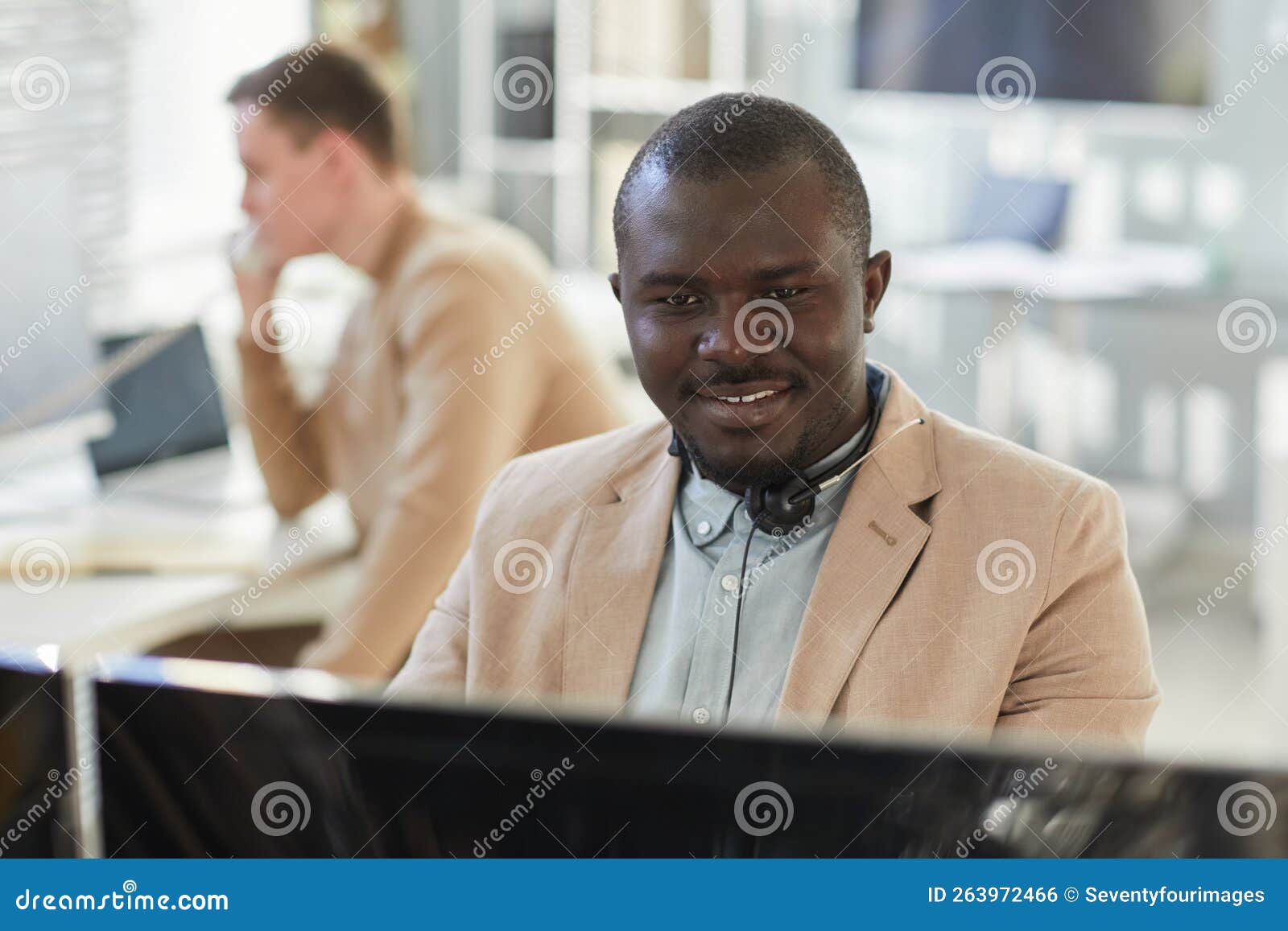Smiling Black Man Looking at Computer in Customer Support Center Stock ...