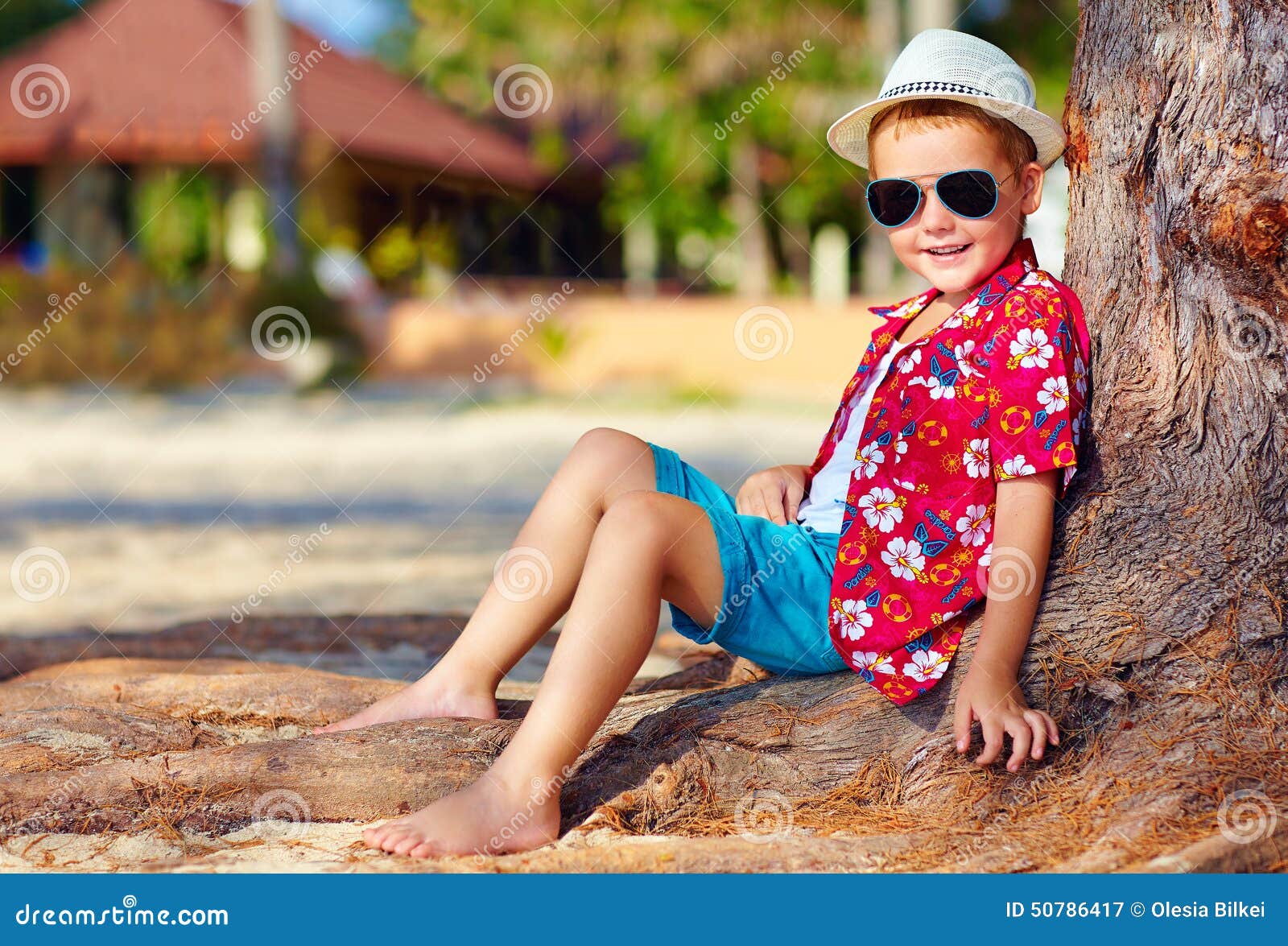 Portrait of Smiling Boy Sitting Under the Tree Stock Image - Image of ...