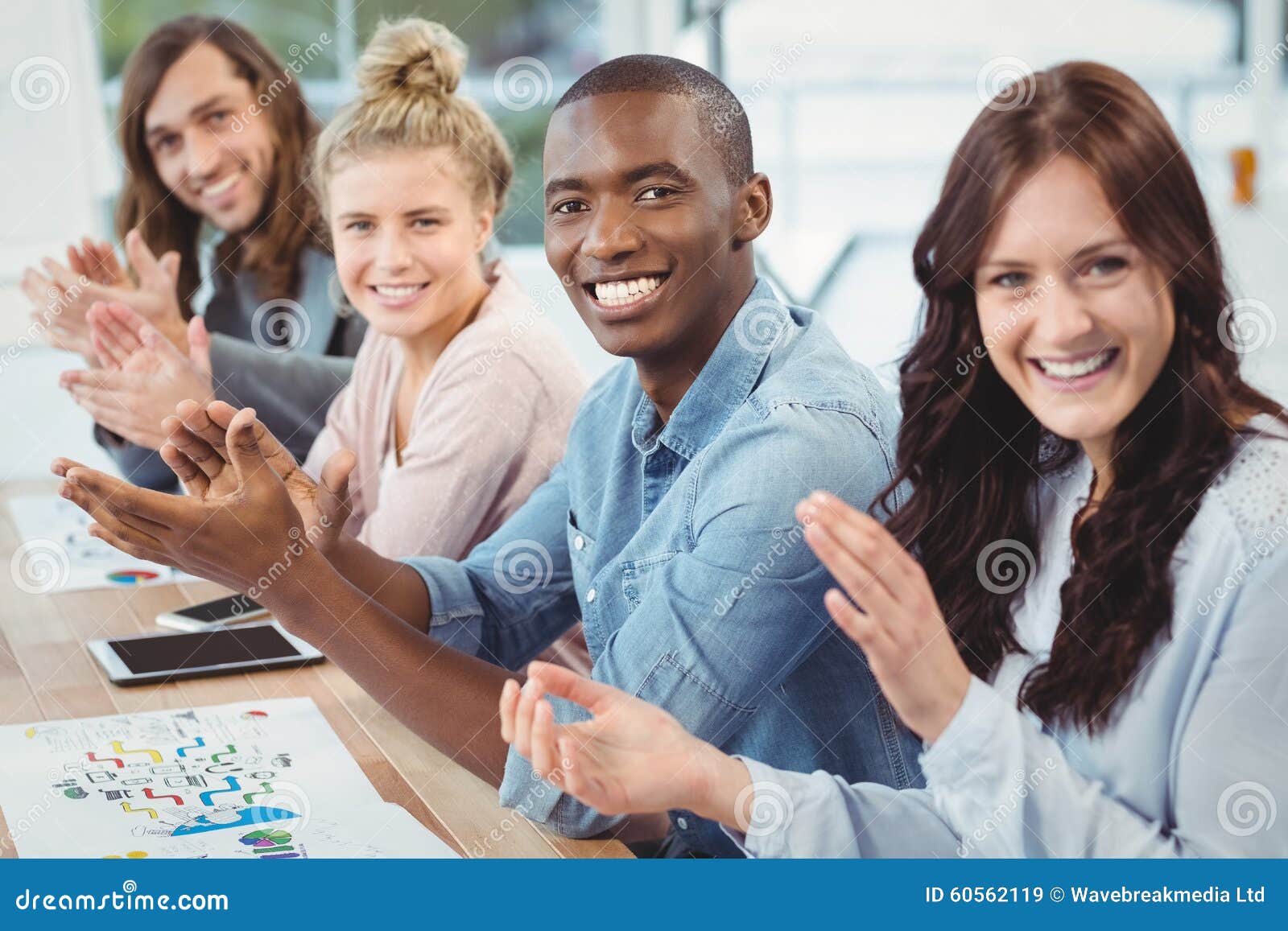 Portrait of Smiling Business People Clapping at Desk Stock Image ...