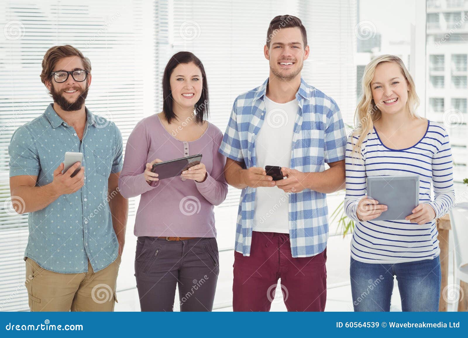 Portrait of Smiling Business People Using Electronic Gadgets Stock ...