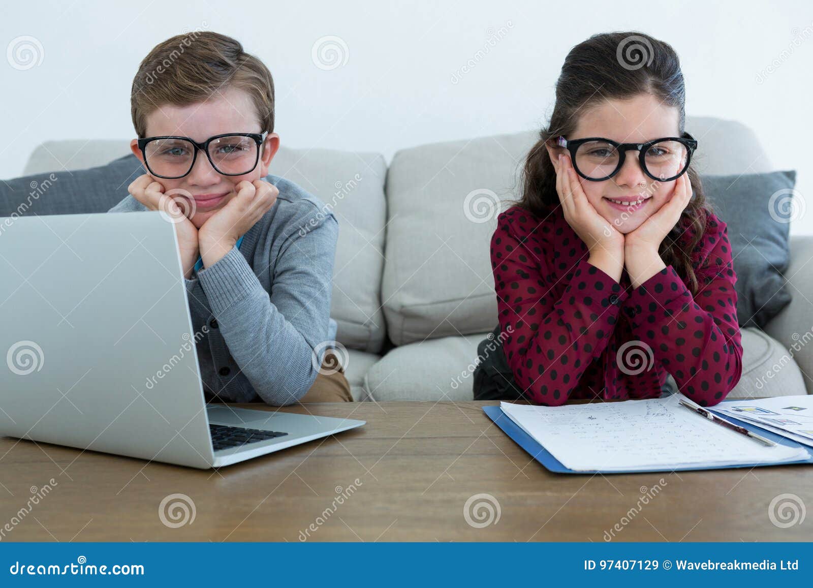 Portrait of Smiling Business People Working while Sitting on Sofa in ...