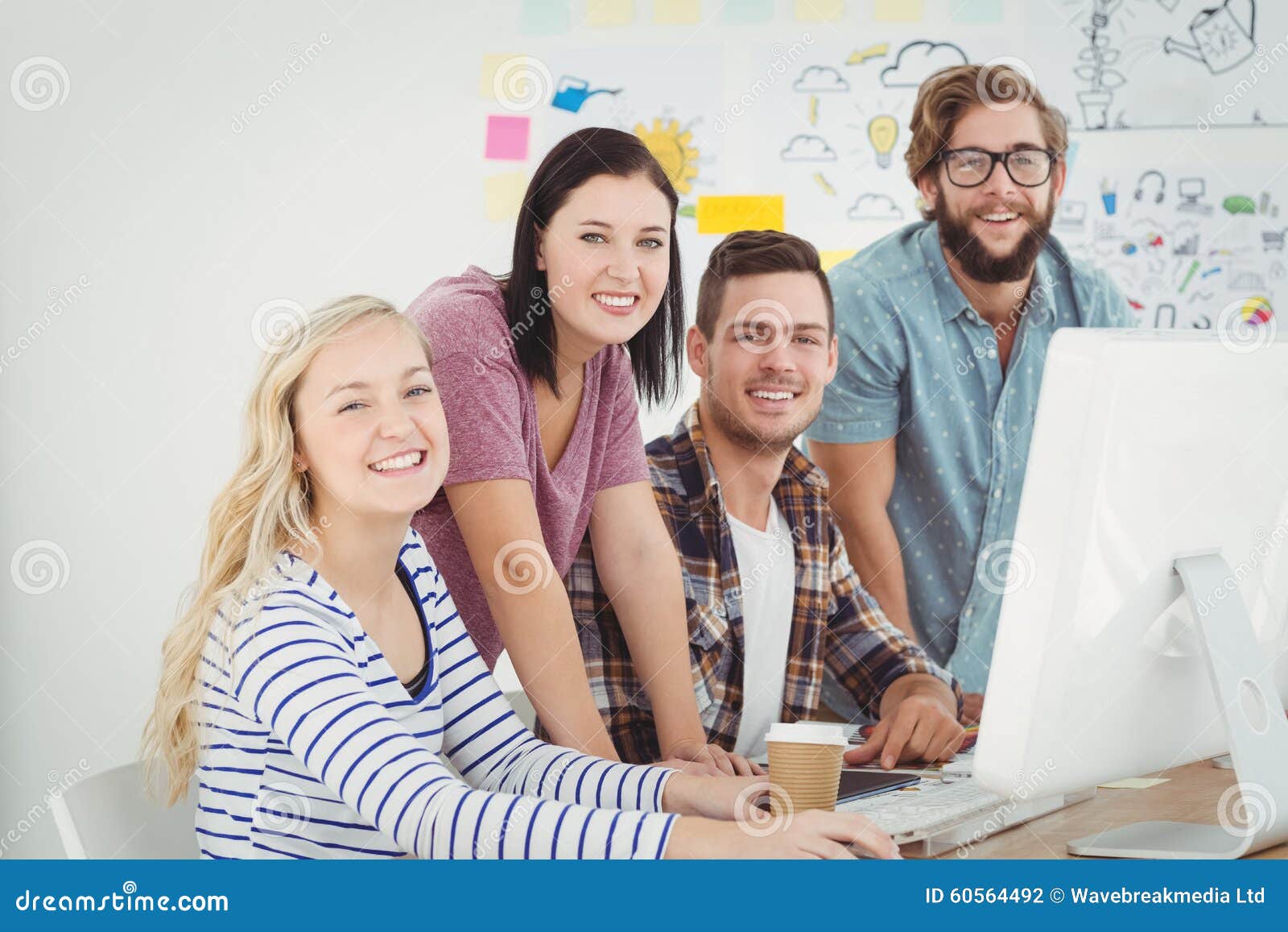 Portrait of Smiling Business Professionals Working at Computer Desk ...