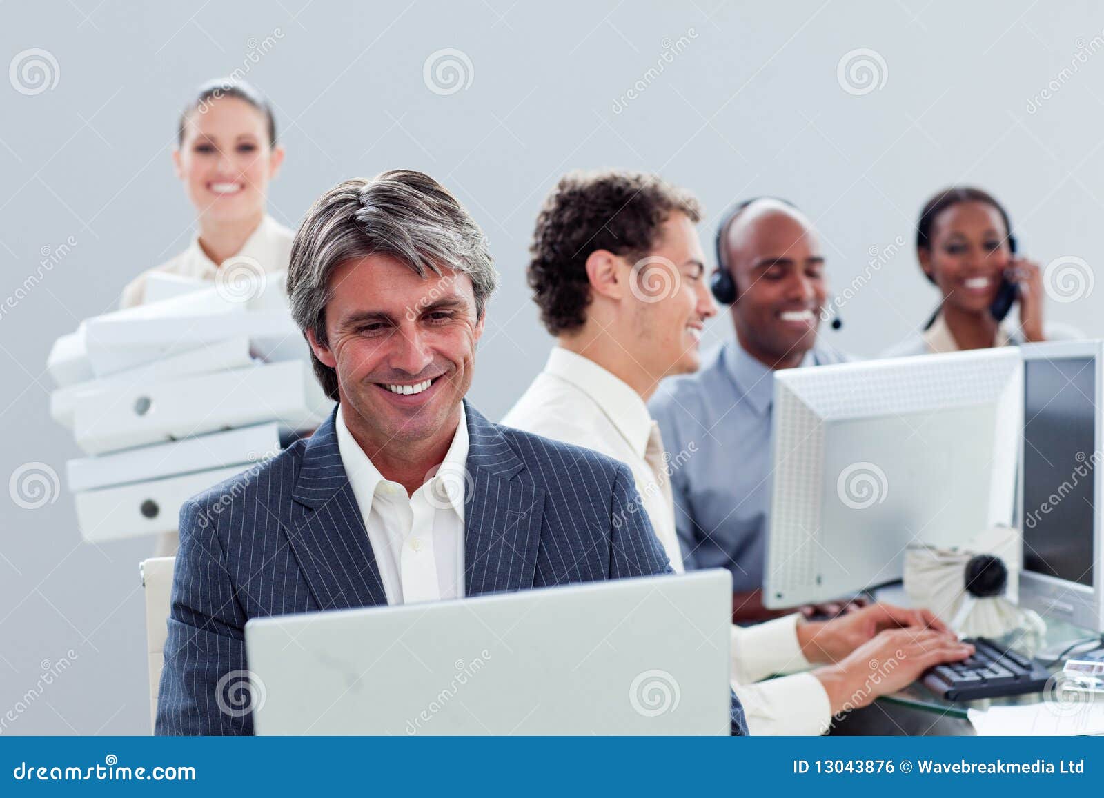 Portrait of a Smiling Business Team at Work Stock Photo - Image of ...