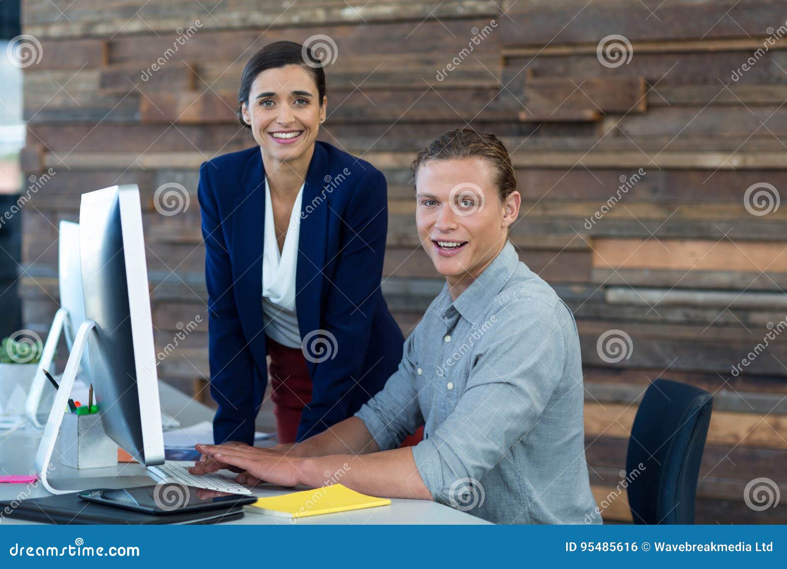 Portrait of Smiling Businesspeople Working on Personal Computer Stock ...
