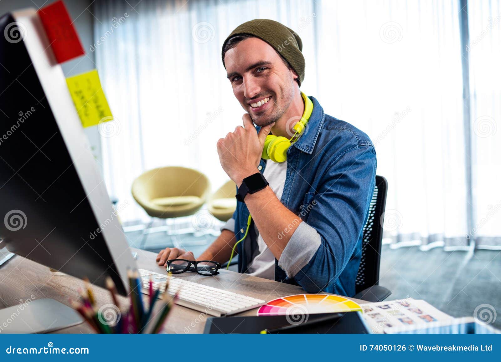 Portrait of Smiling Casual Man Working at Computer Desk Stock Photo ...